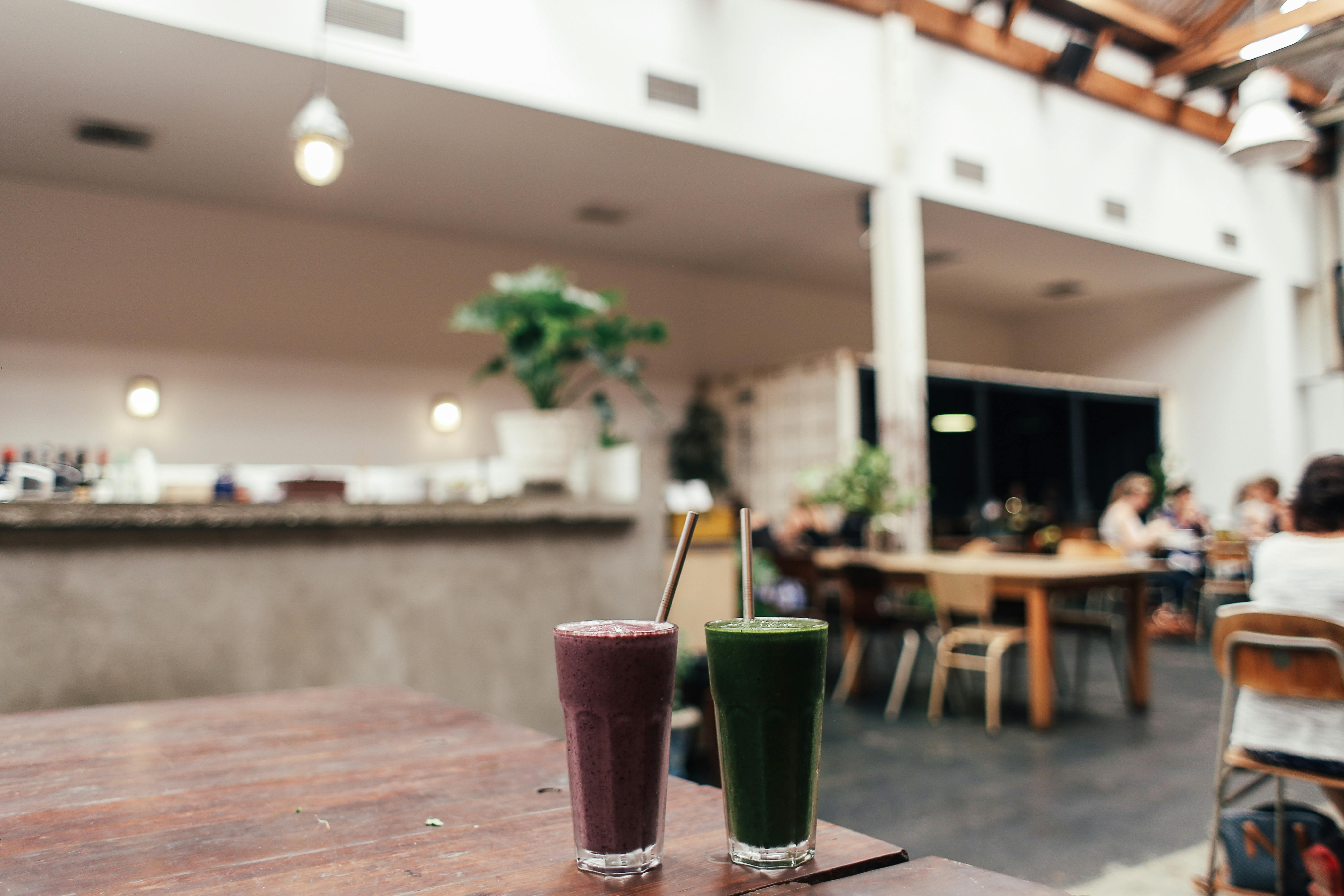Smoothies Standing on a Table in a Restaurant · Free Stock Photo
