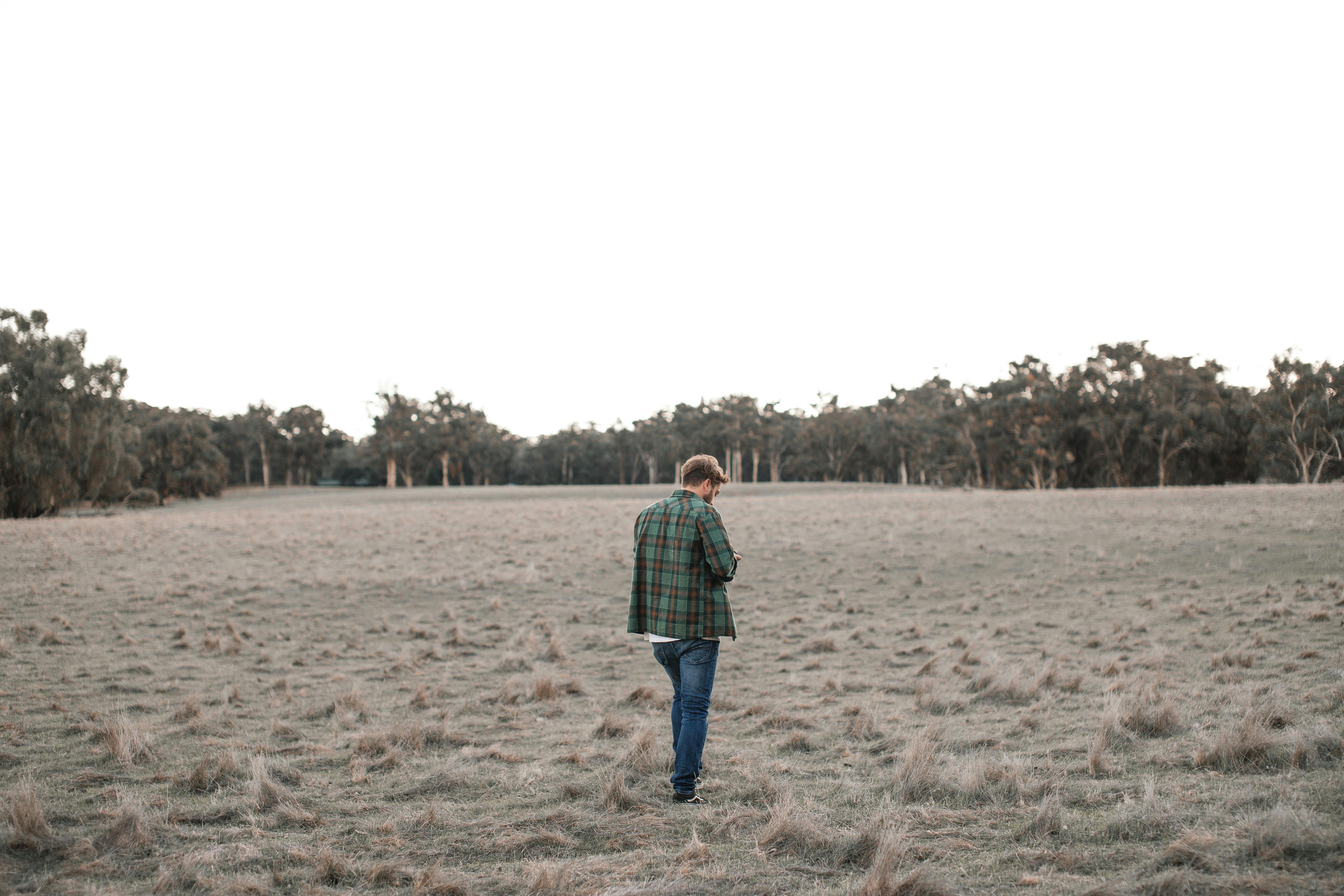 A Man Standing on a Field · Free Stock Photo