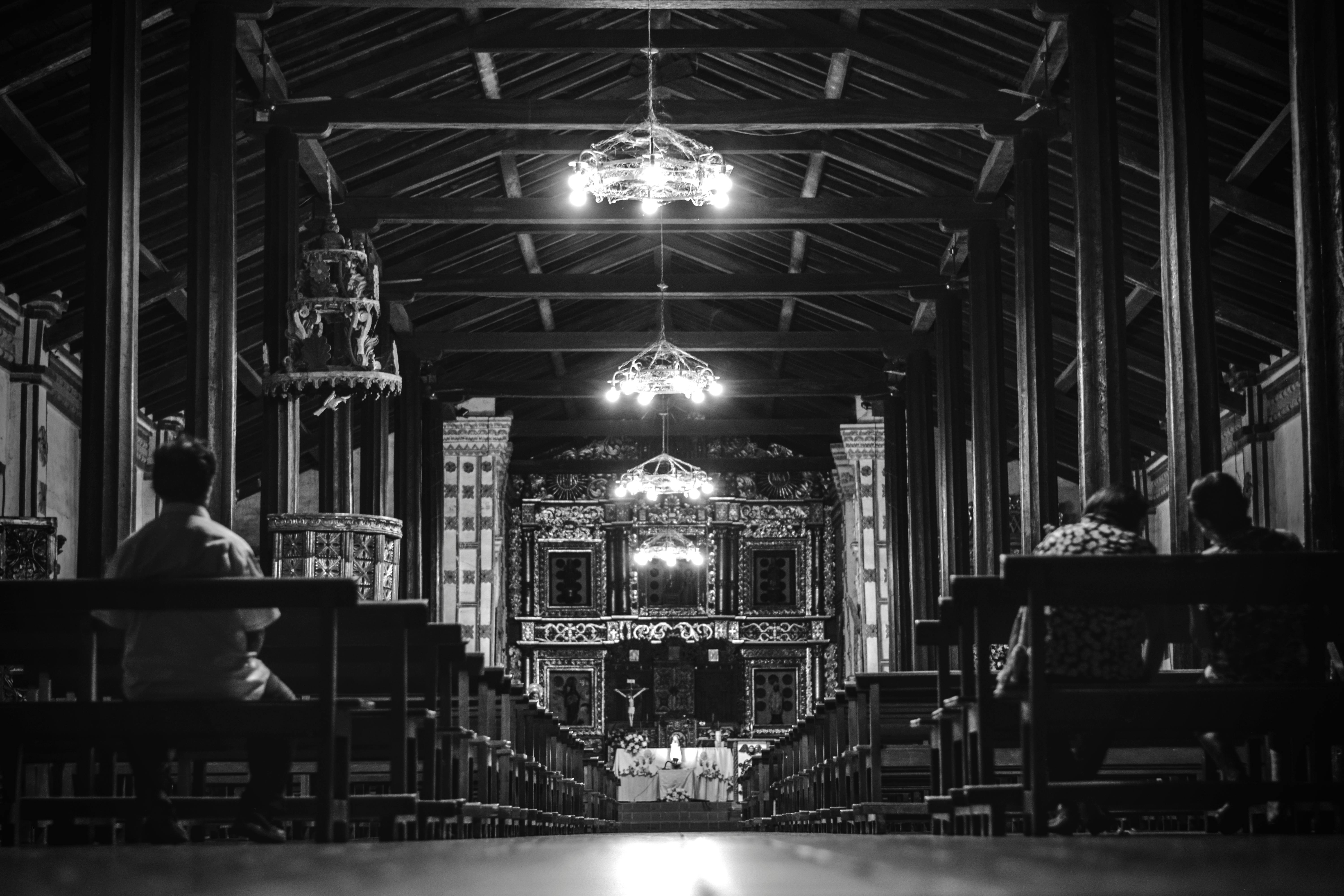 Grayscale Photo of People Sitting Inside the Church · Free Stock Photo