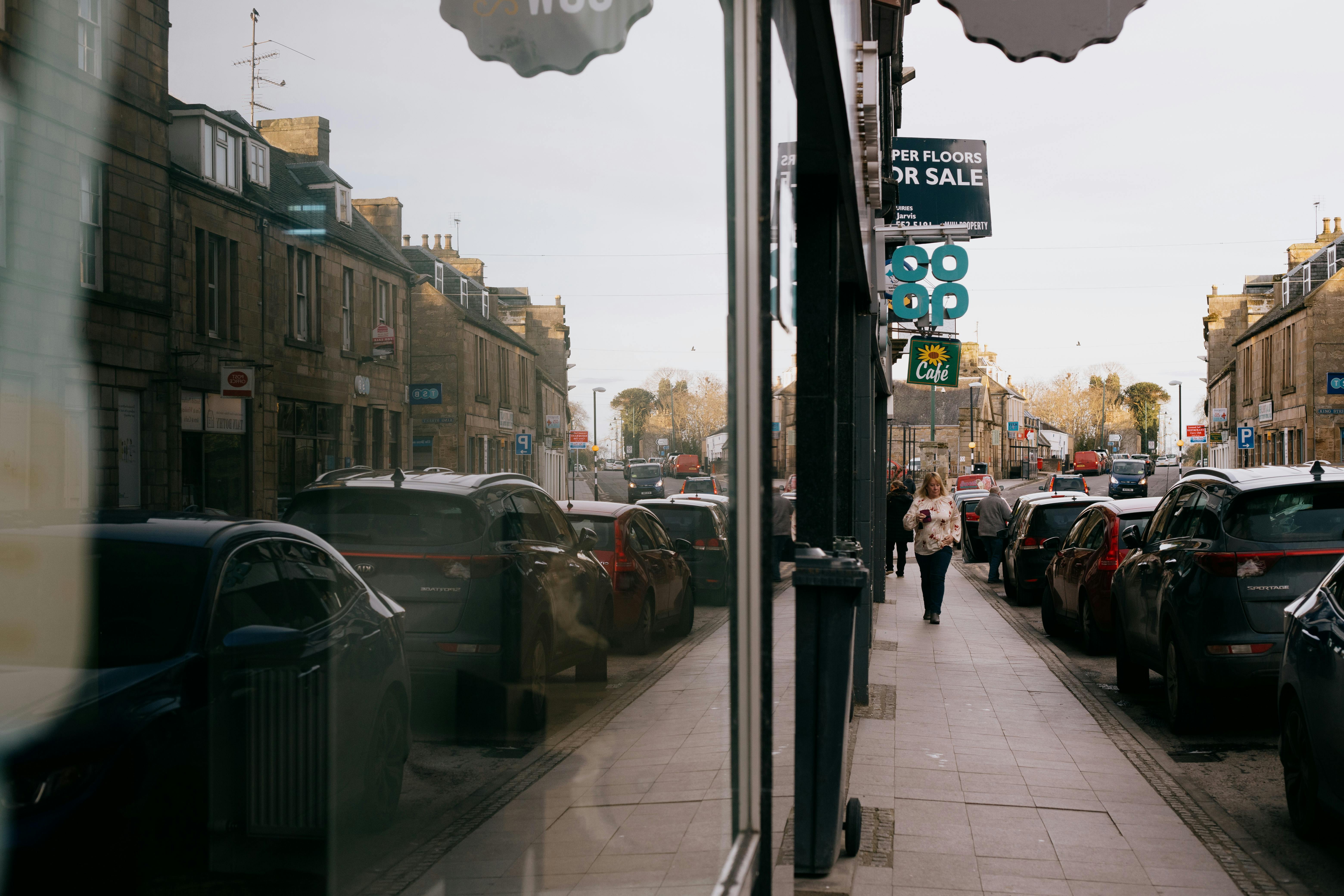 Busy narrow paved street with people · Free Stock Photo