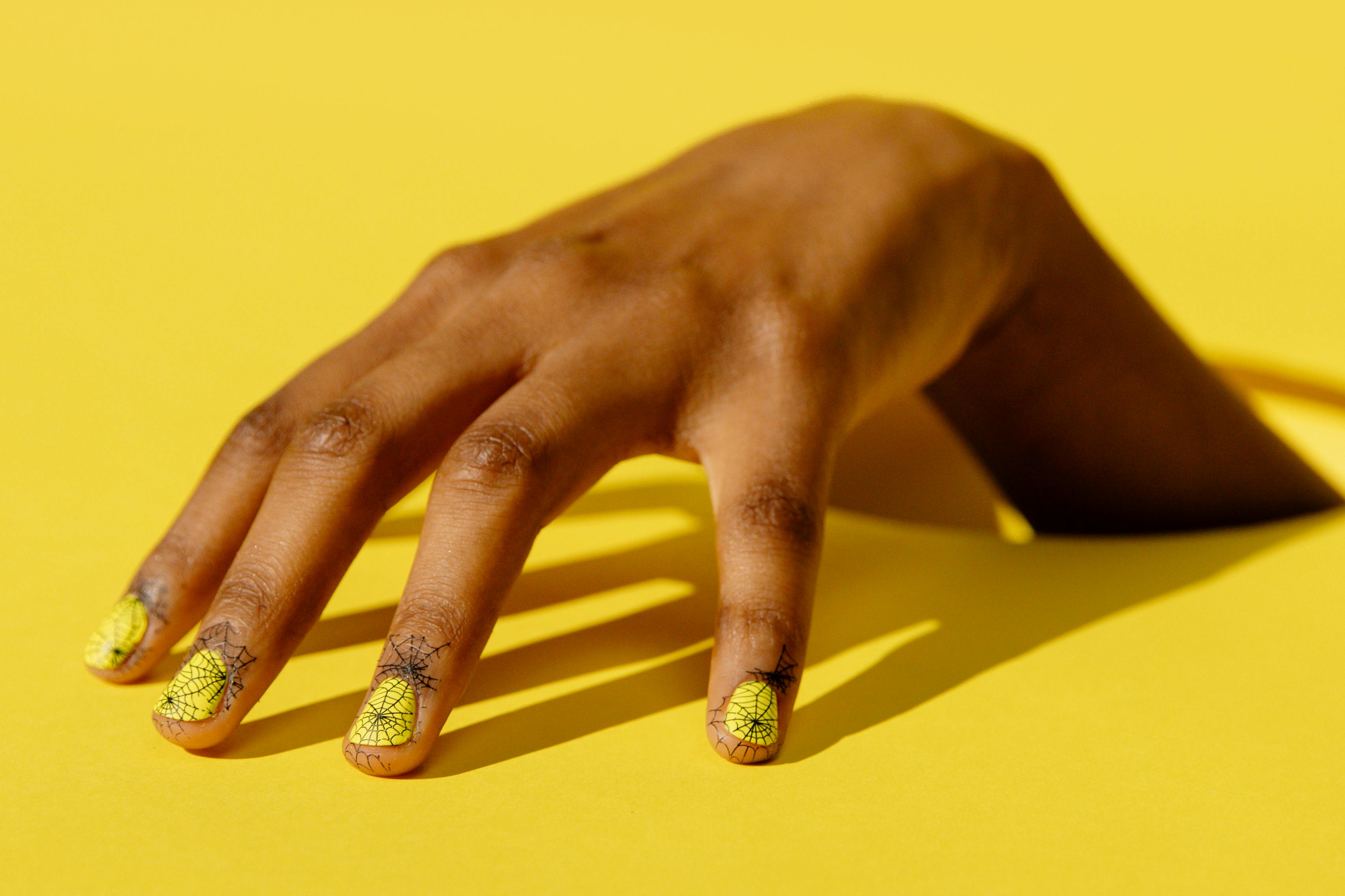 Hand in Yellow Background · Free Stock Photo