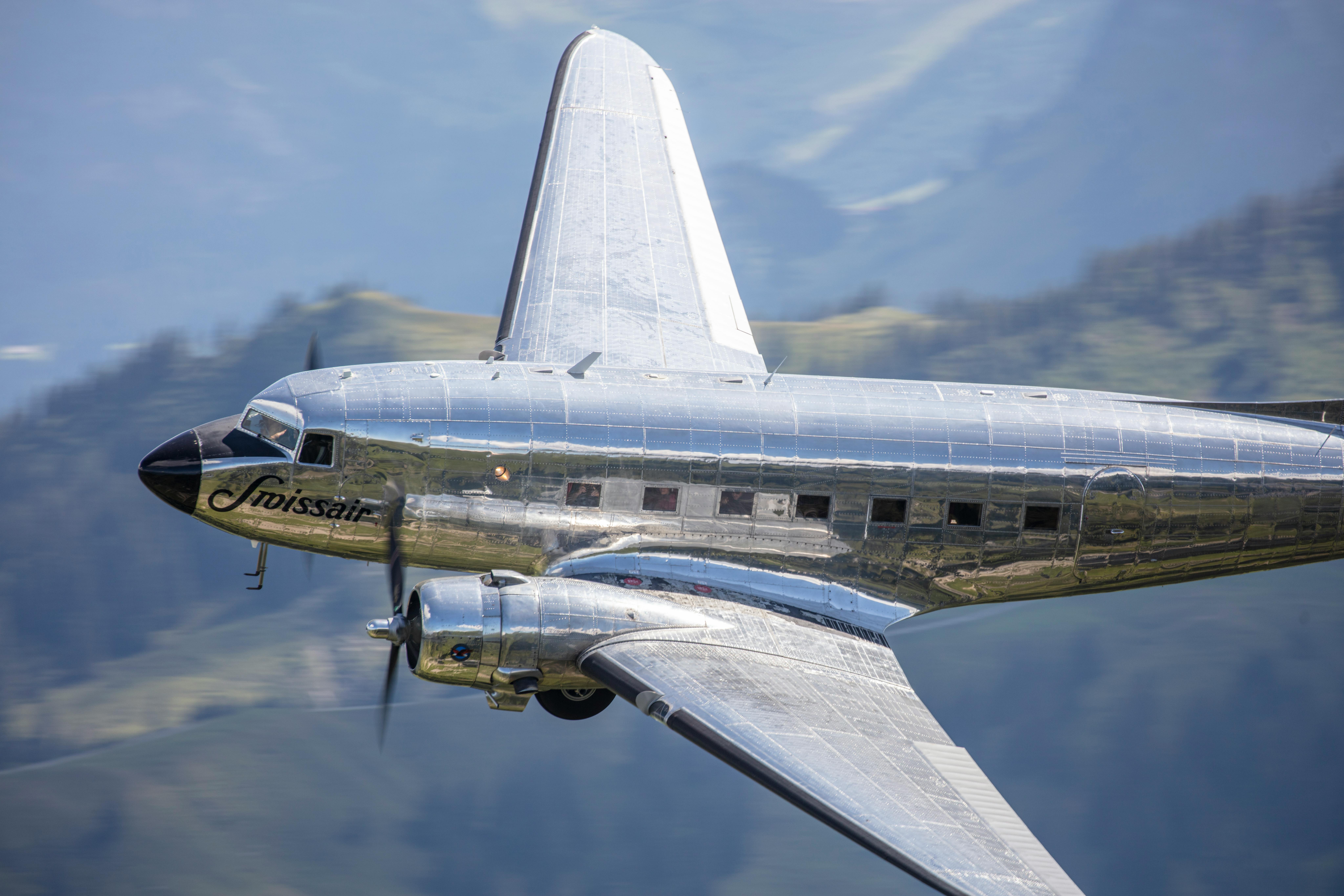 Shiny Airplane Flying in the Sky · Free Stock Photo