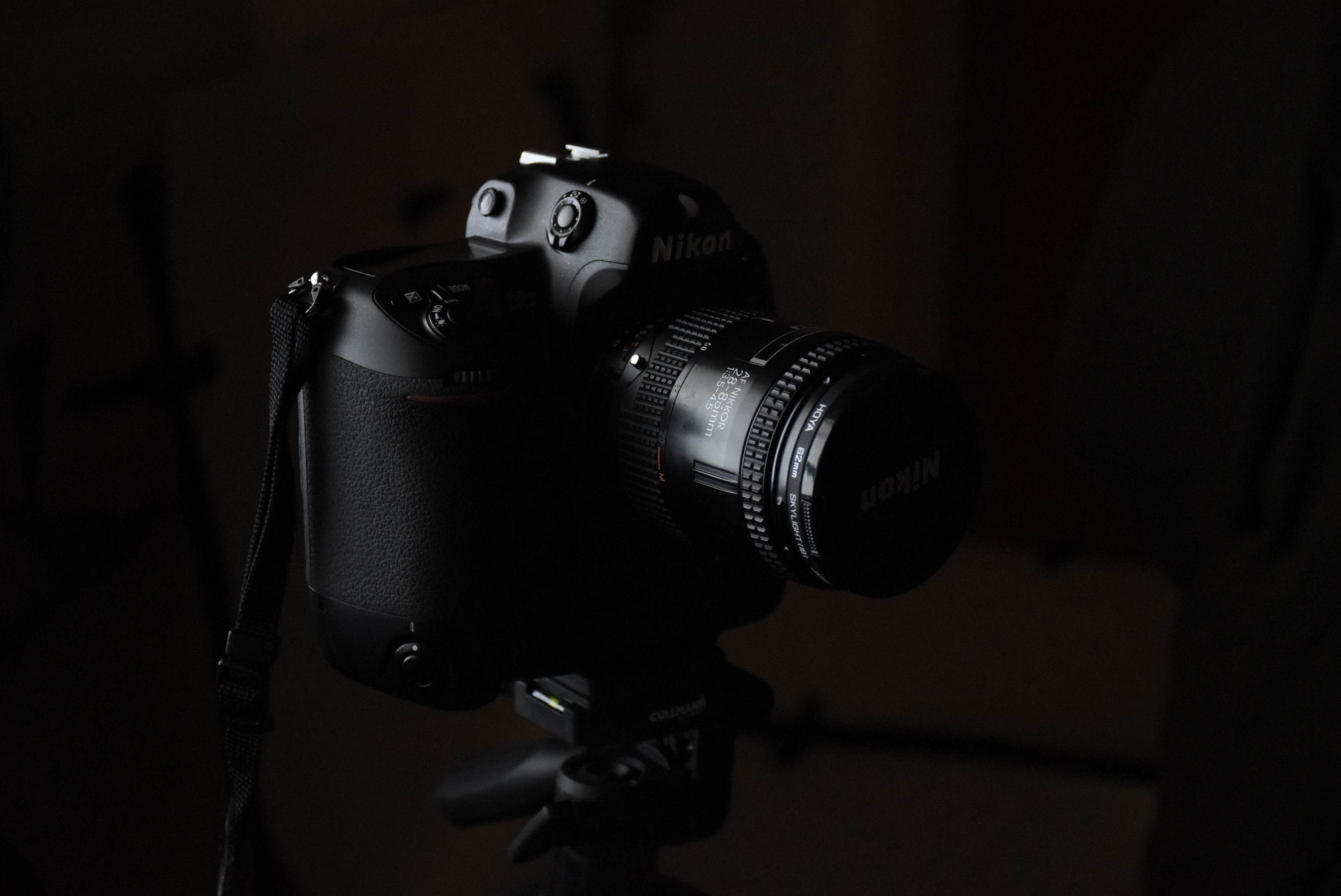 Black Dslr Camera on White Surface · Free Stock Photo