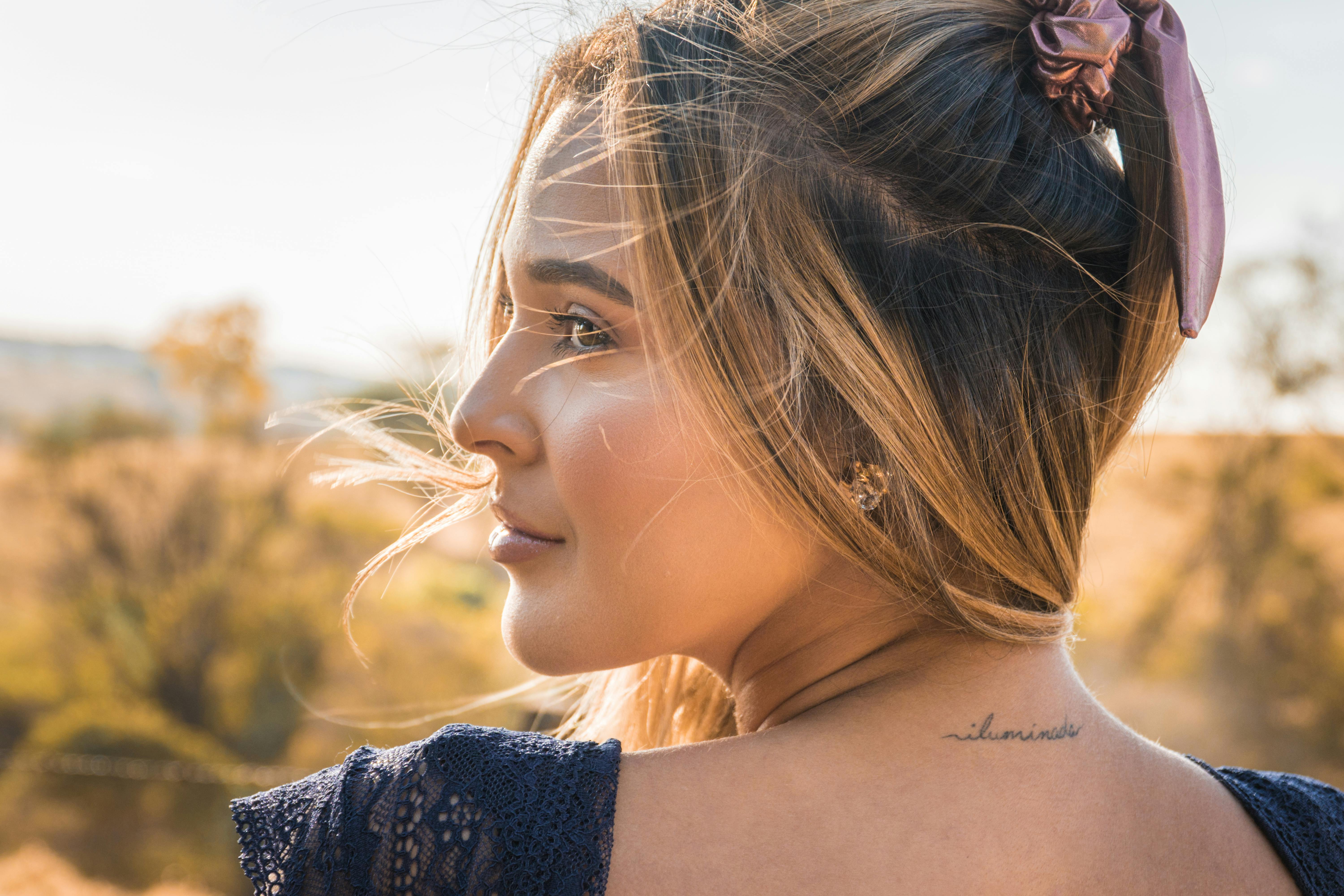 Close-Up Photo of a Beautiful Woman Looking Back · Free Stock Photo