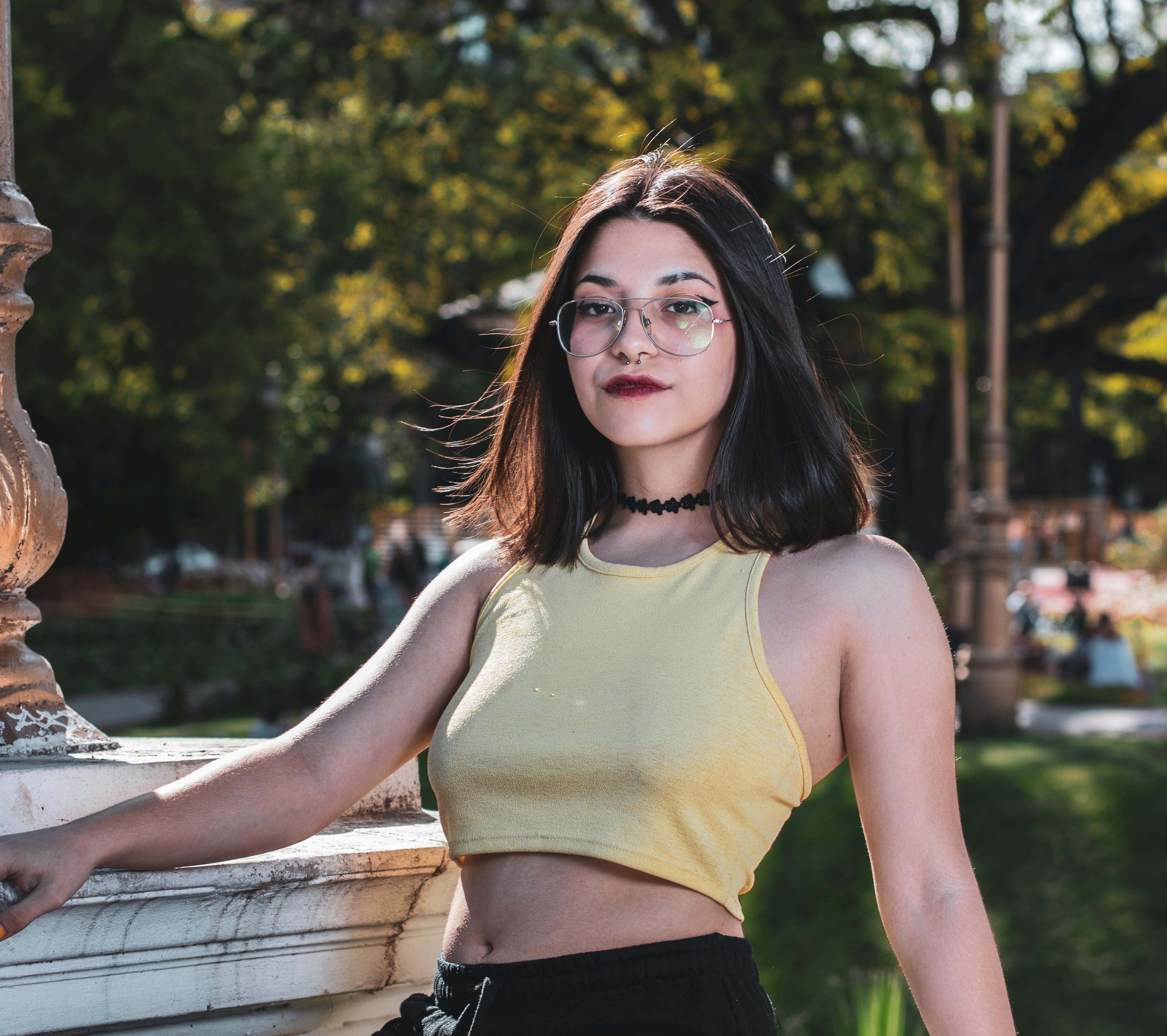 Woman in Yellow Tank Top Wearing Silver Framed Eyeglasses · Free Stock ...