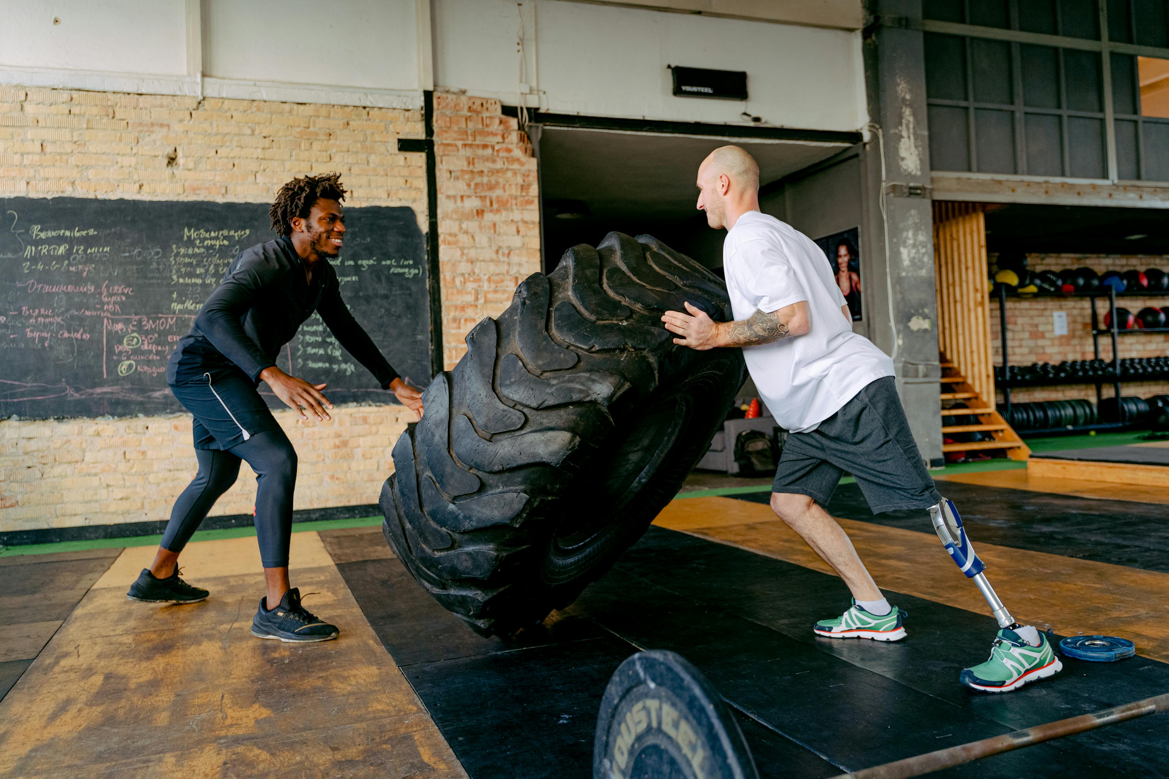 Man with a Prosthetic Leg Exercising at the Gym · Free Stock Photo