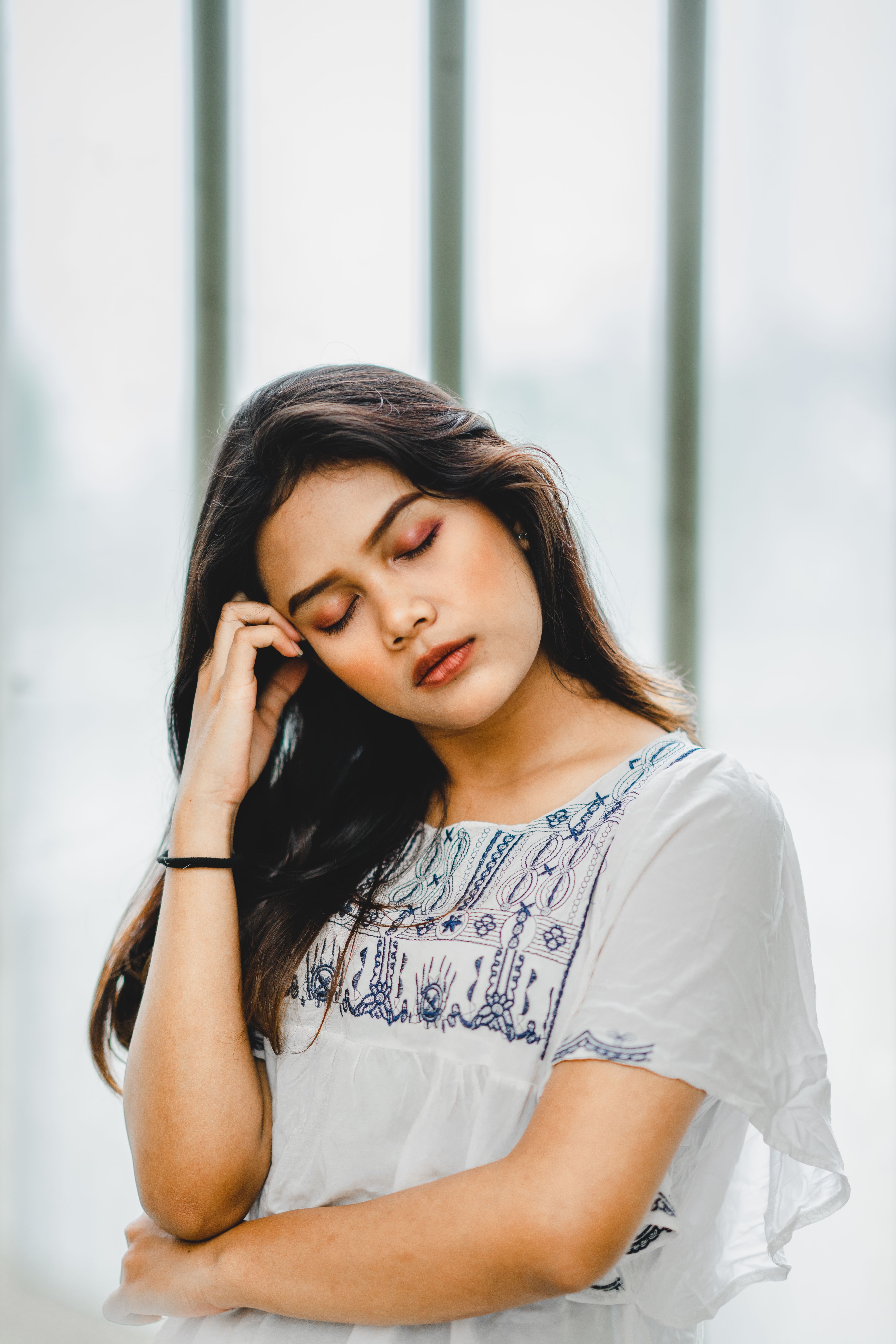 Woman Thinking with Eyes Closed · Free Stock Photo