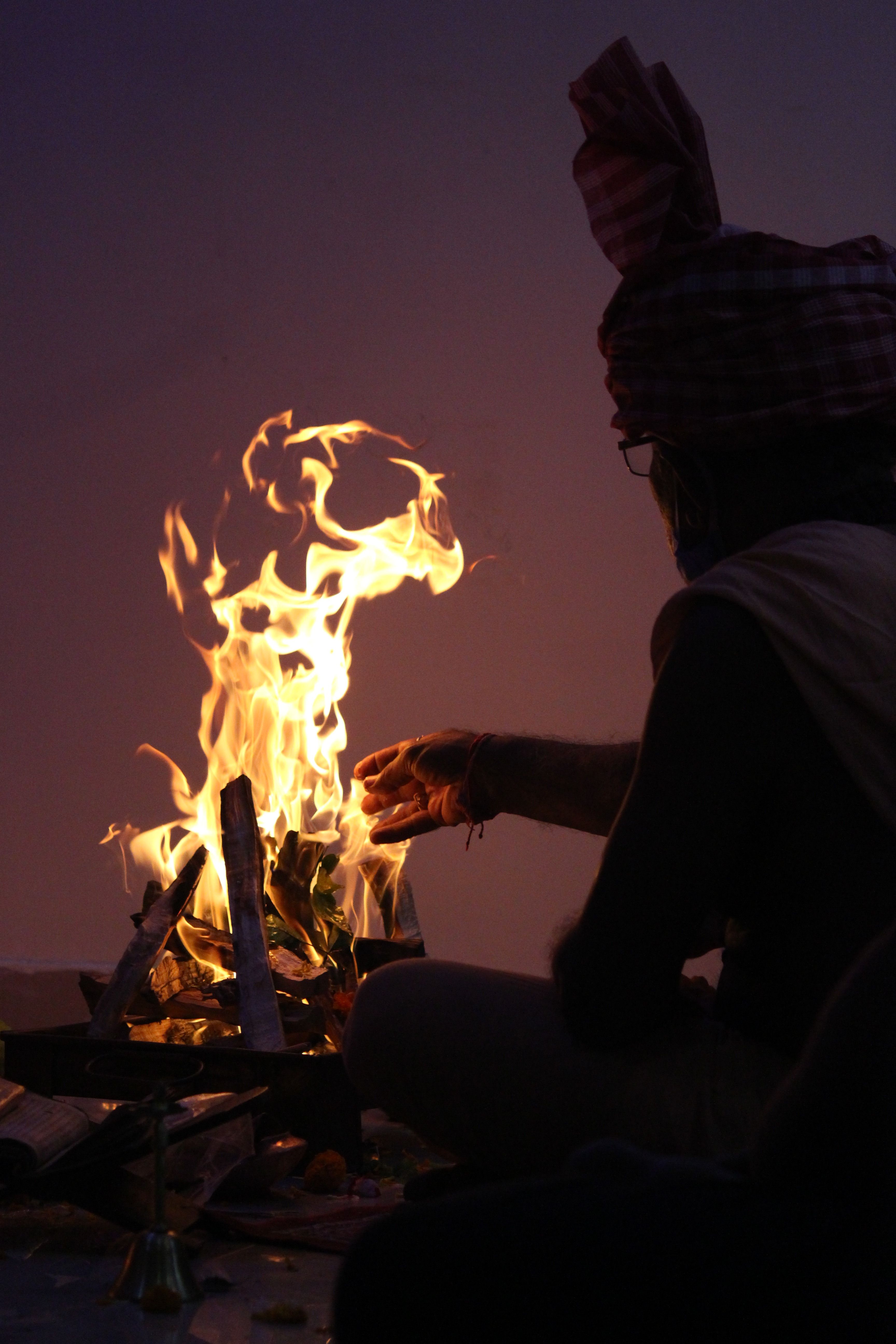 Person Sitting in Front of a Bonfire · Free Stock Photo