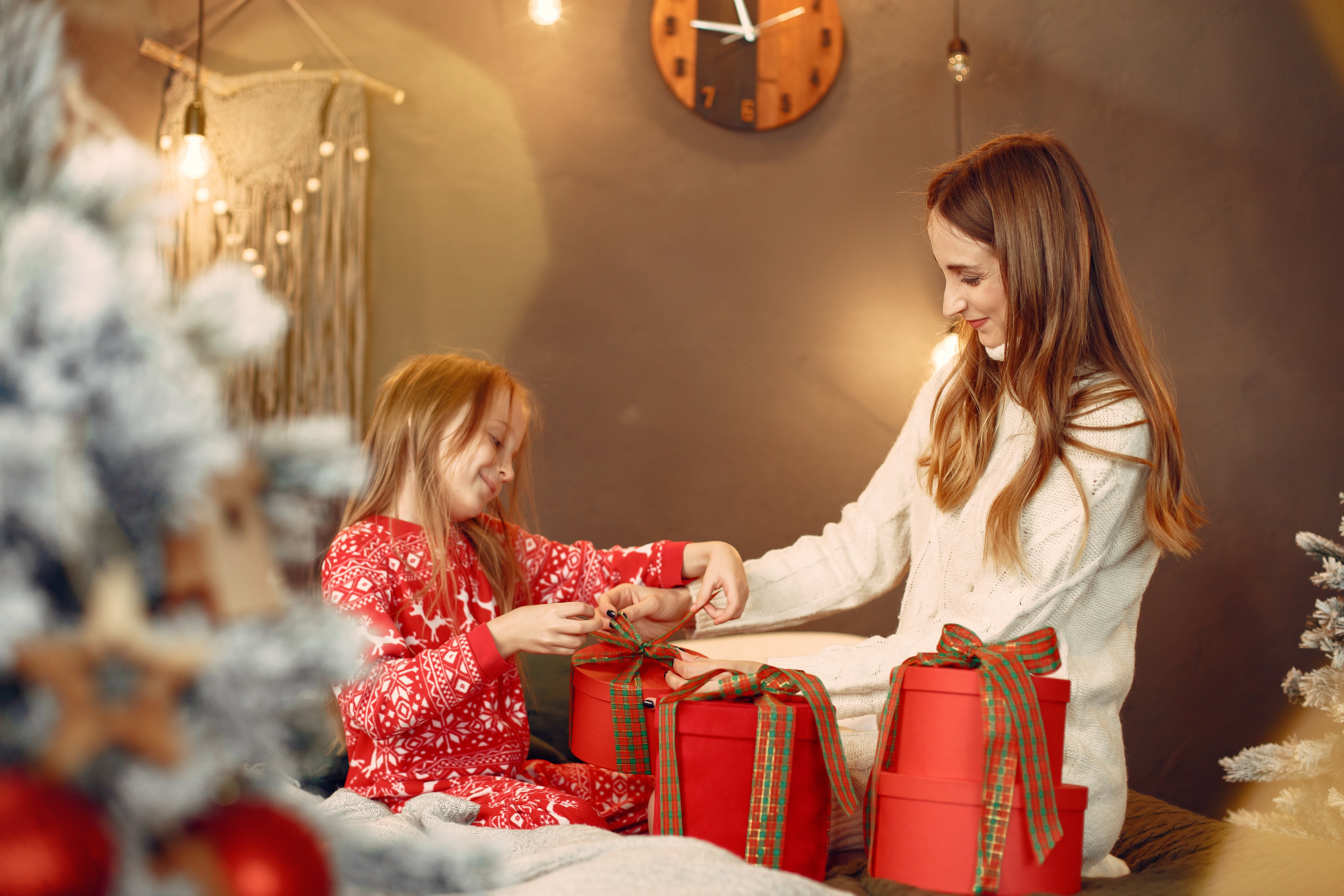 Two Kids Giving Gifts to their Mother · Free Stock Photo