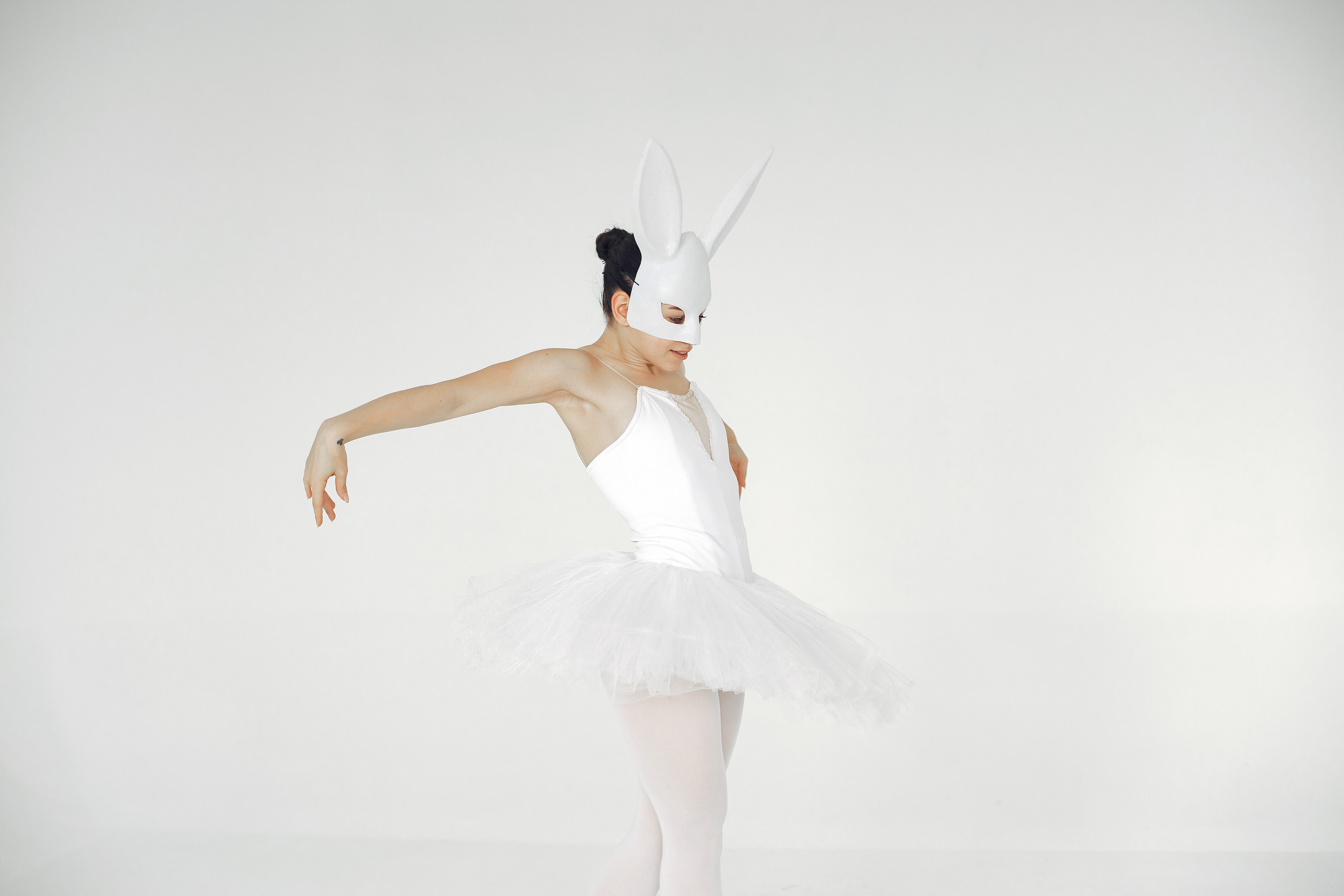 Masked Ballet Dancer in White · Free Stock Photo
