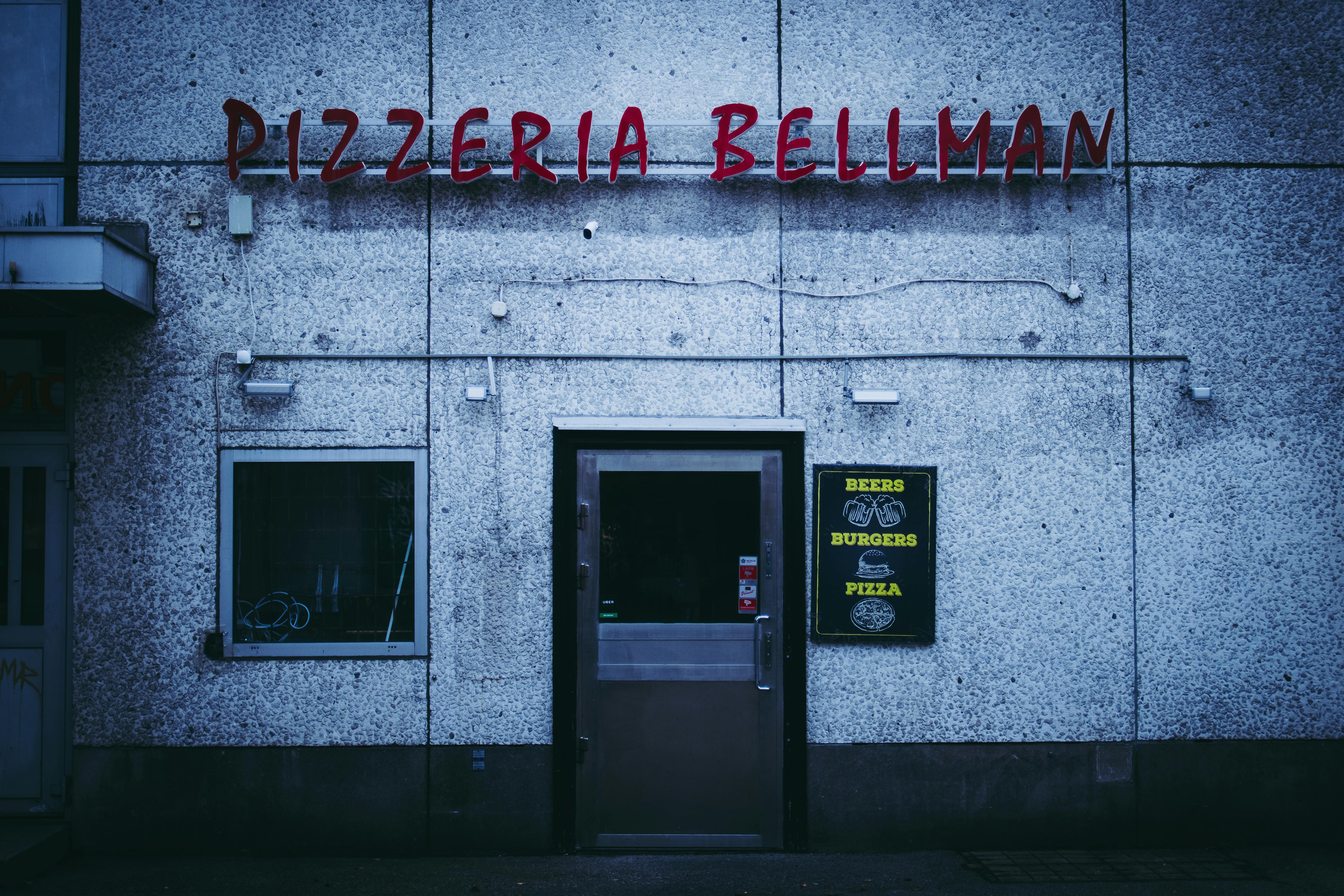 Pizzeria Bellman Red Signage Outside the Restaurant Wall · Free Stock Photo