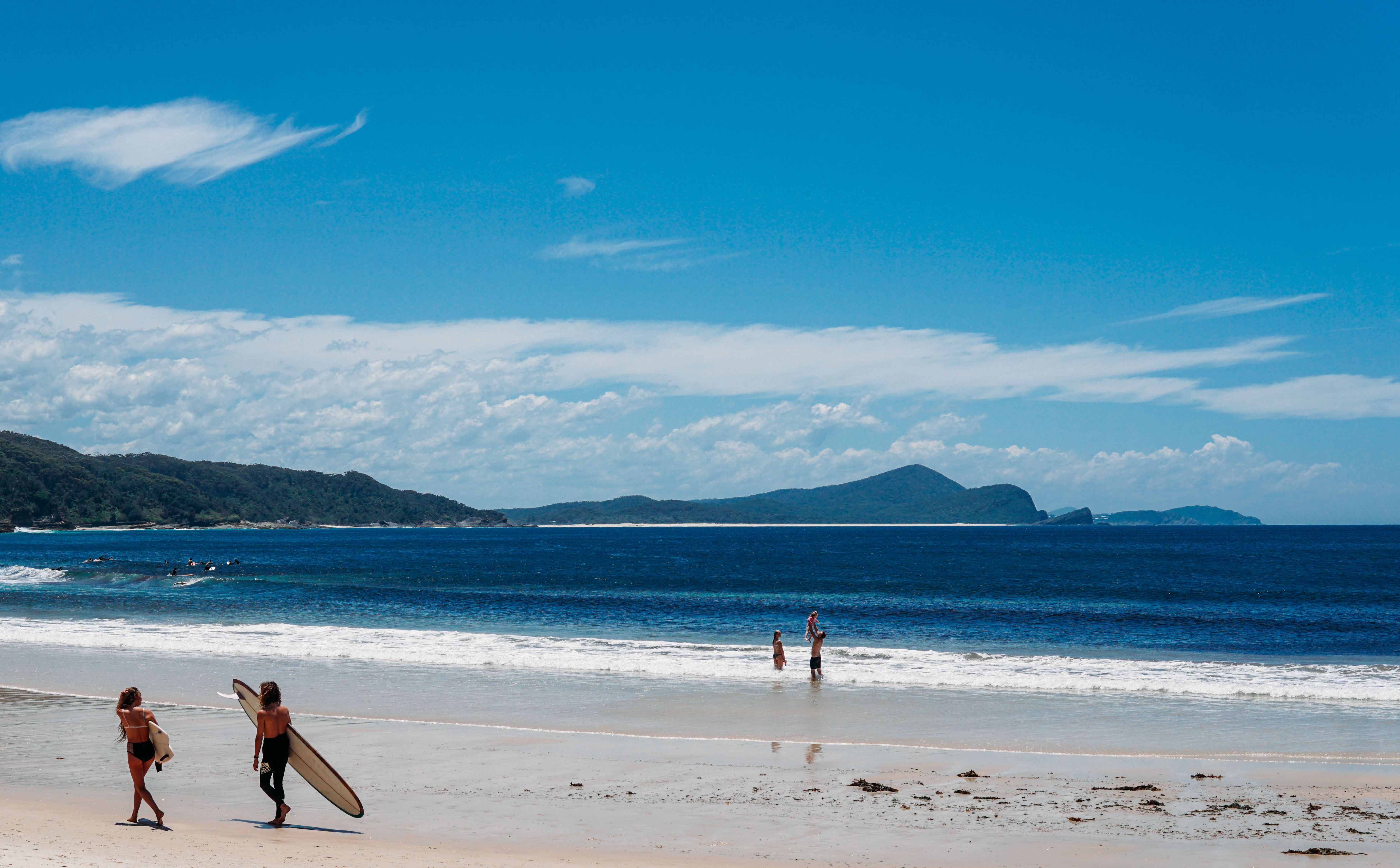 People Swimming on the Seashore · Free Stock Photo
