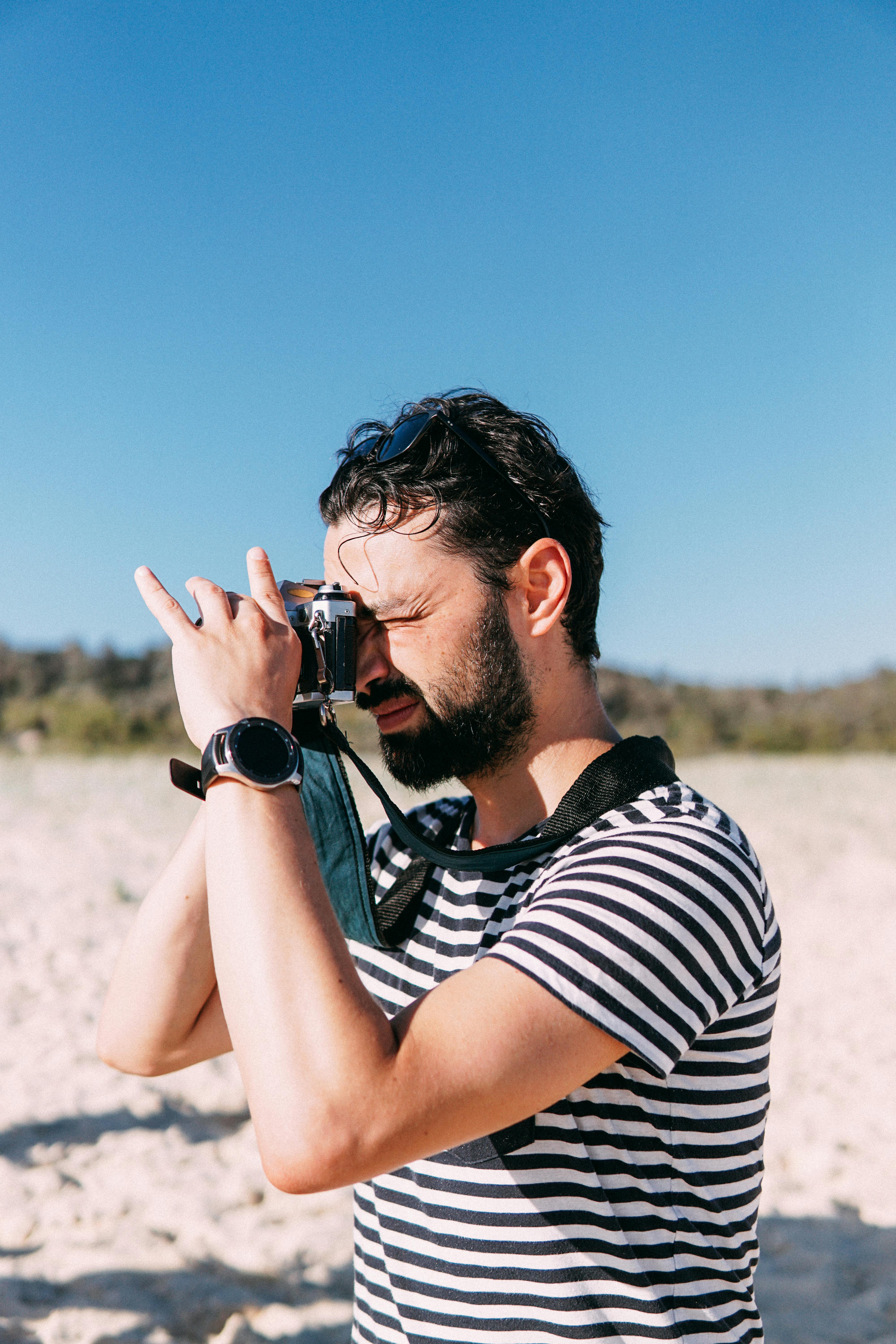 Man Taking Picture Using Canon Dslr Camera · Free Stock Photo