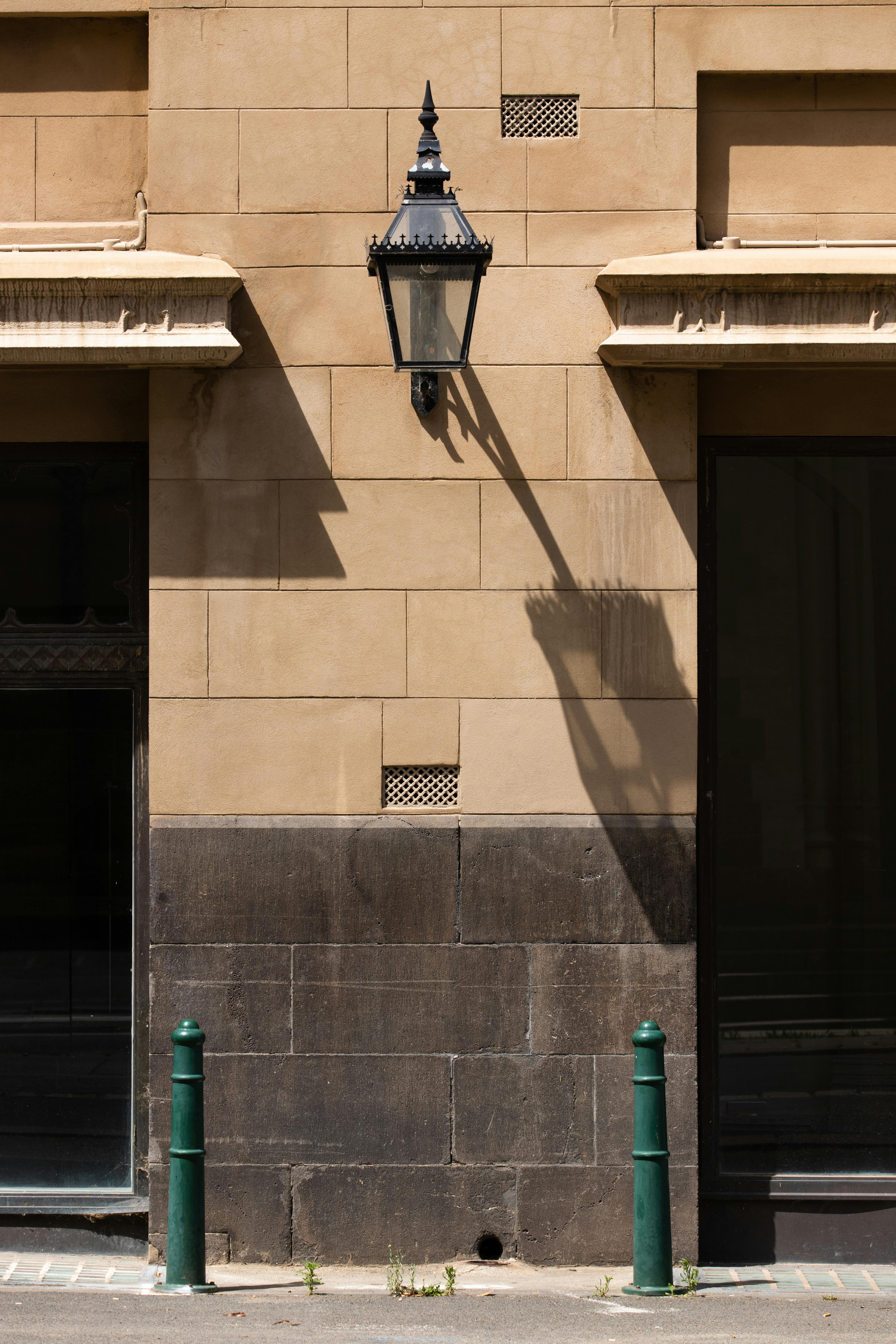 Photograph of a Street Lamp Near a Building · Free Stock Photo