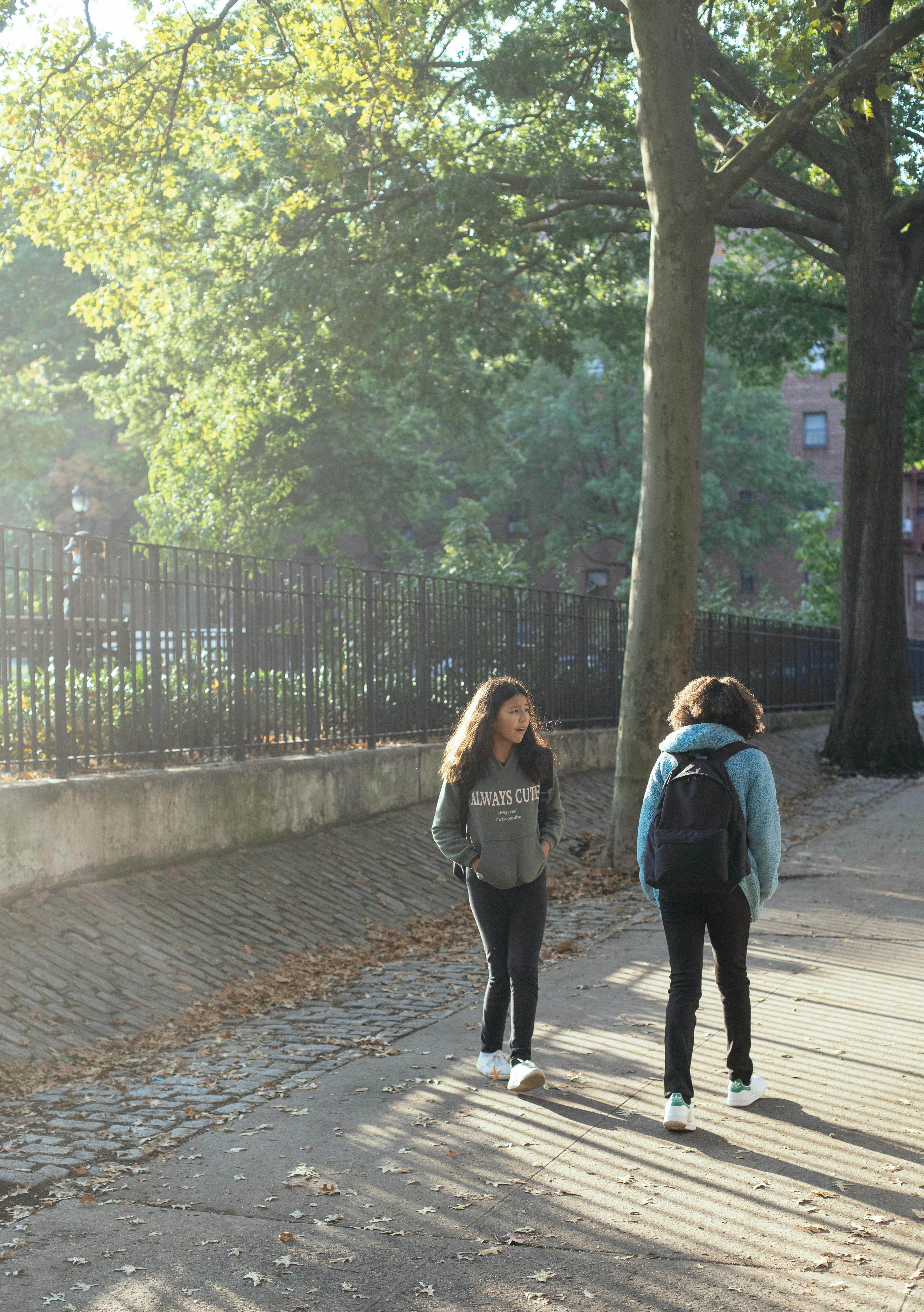 Little girls walking together after school · Free Stock Photo