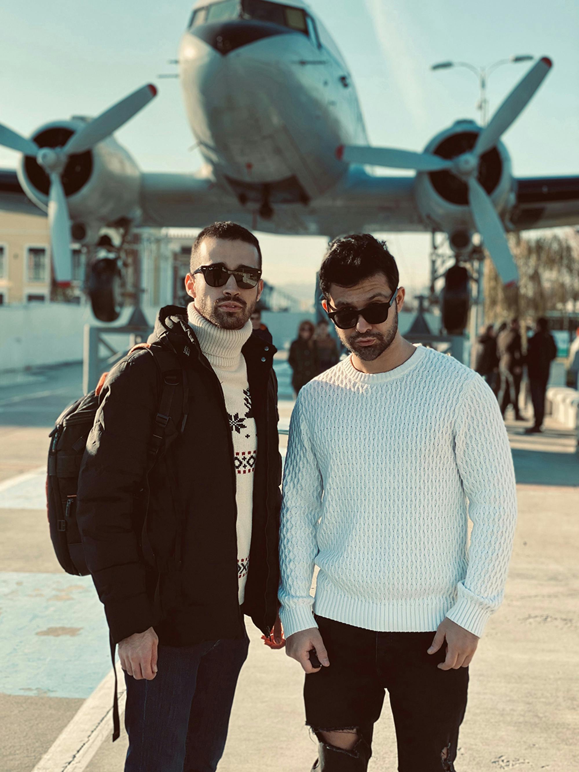 Photograph of a Man Setting Up a Camera · Free Stock Photo