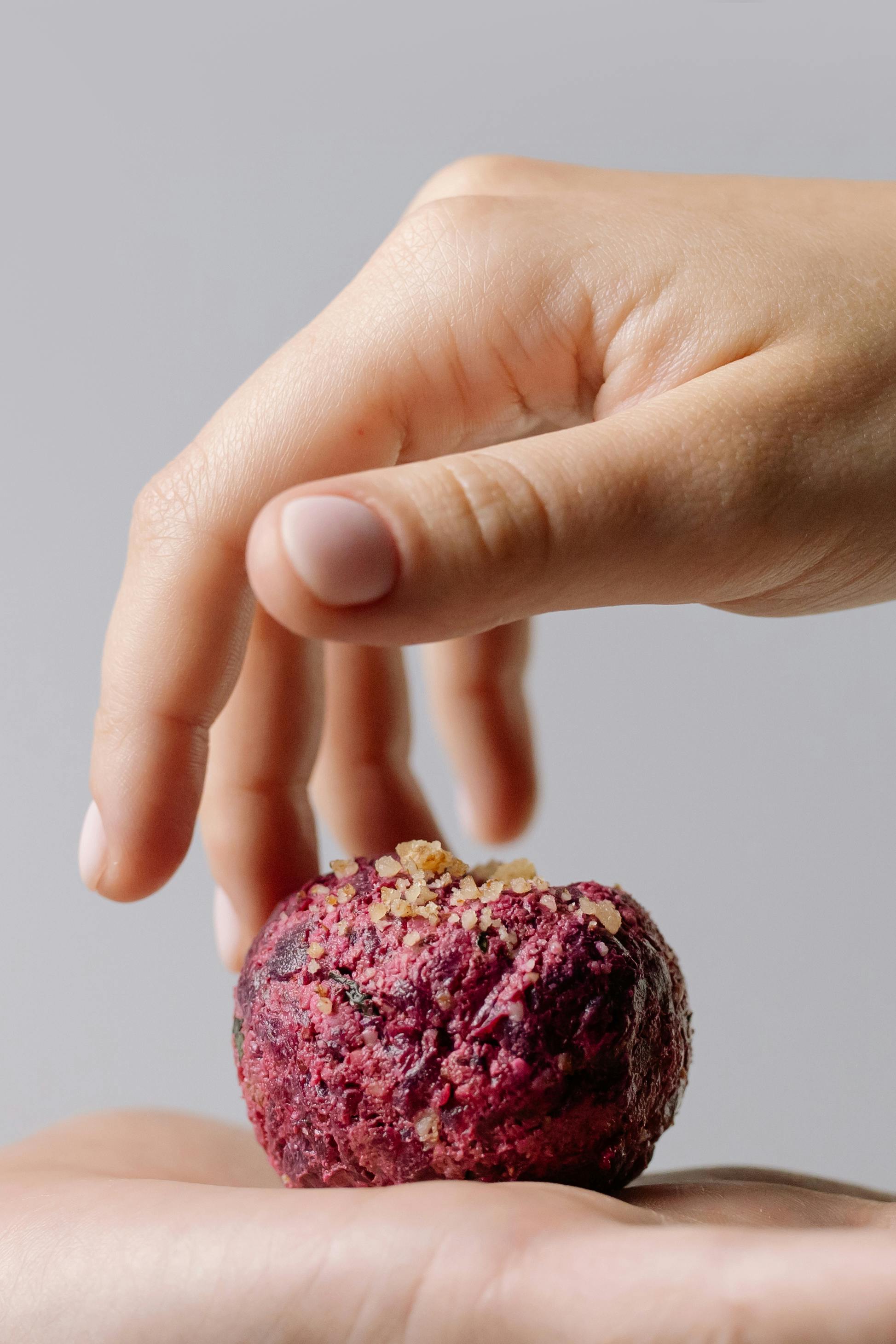 Person Holding Beetroot Pkhali · Free Stock Photo