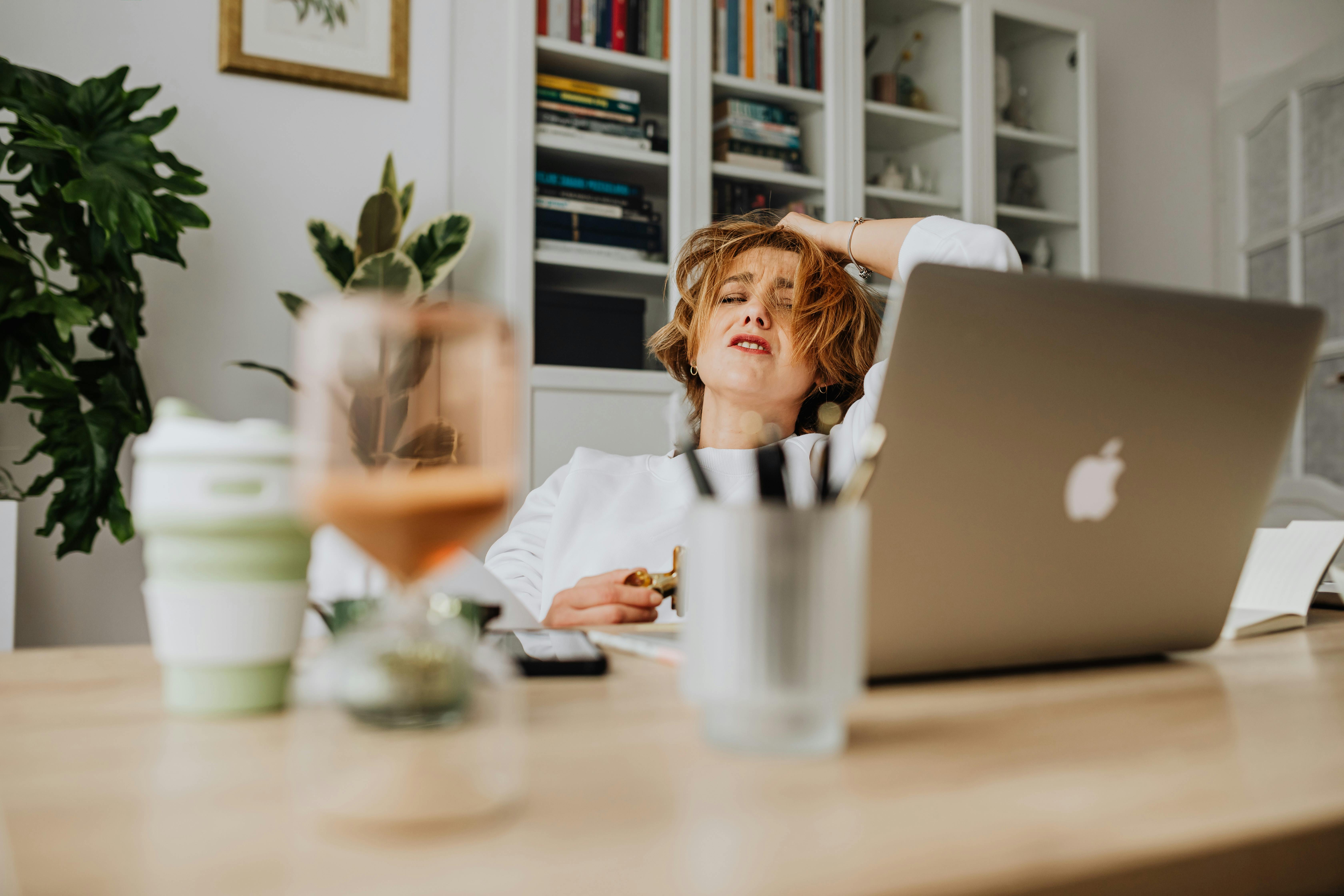 Stressed Woman Working with Laptop · Free Stock Photo