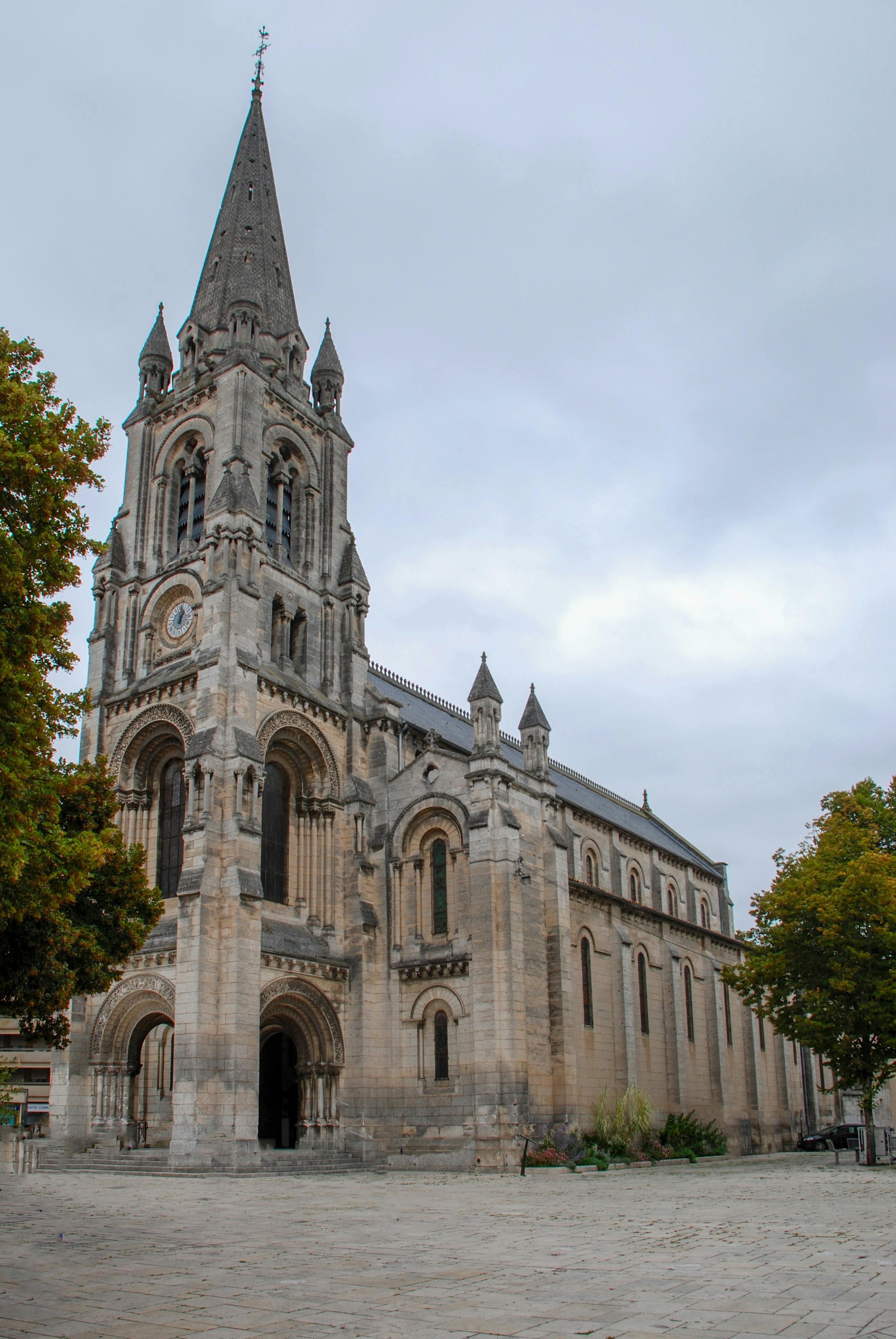 Photo of an Church with Round Arches and a Tower · Free Stock Photo