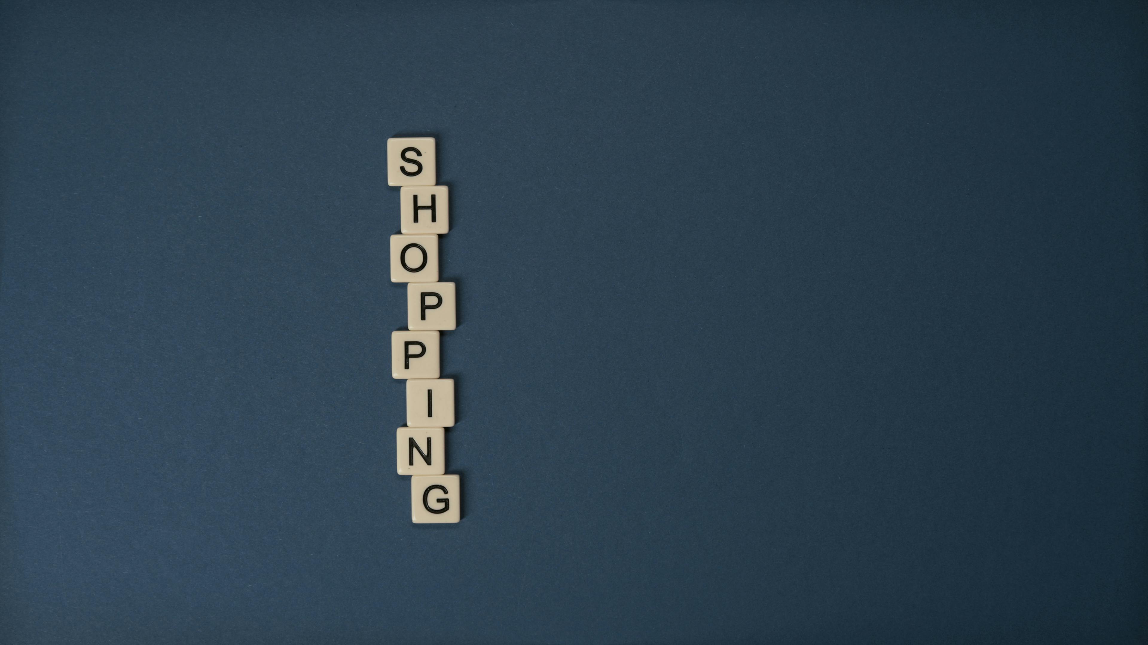 Arranged Scrabble Tiles on Blue Surface · Free Stock Photo