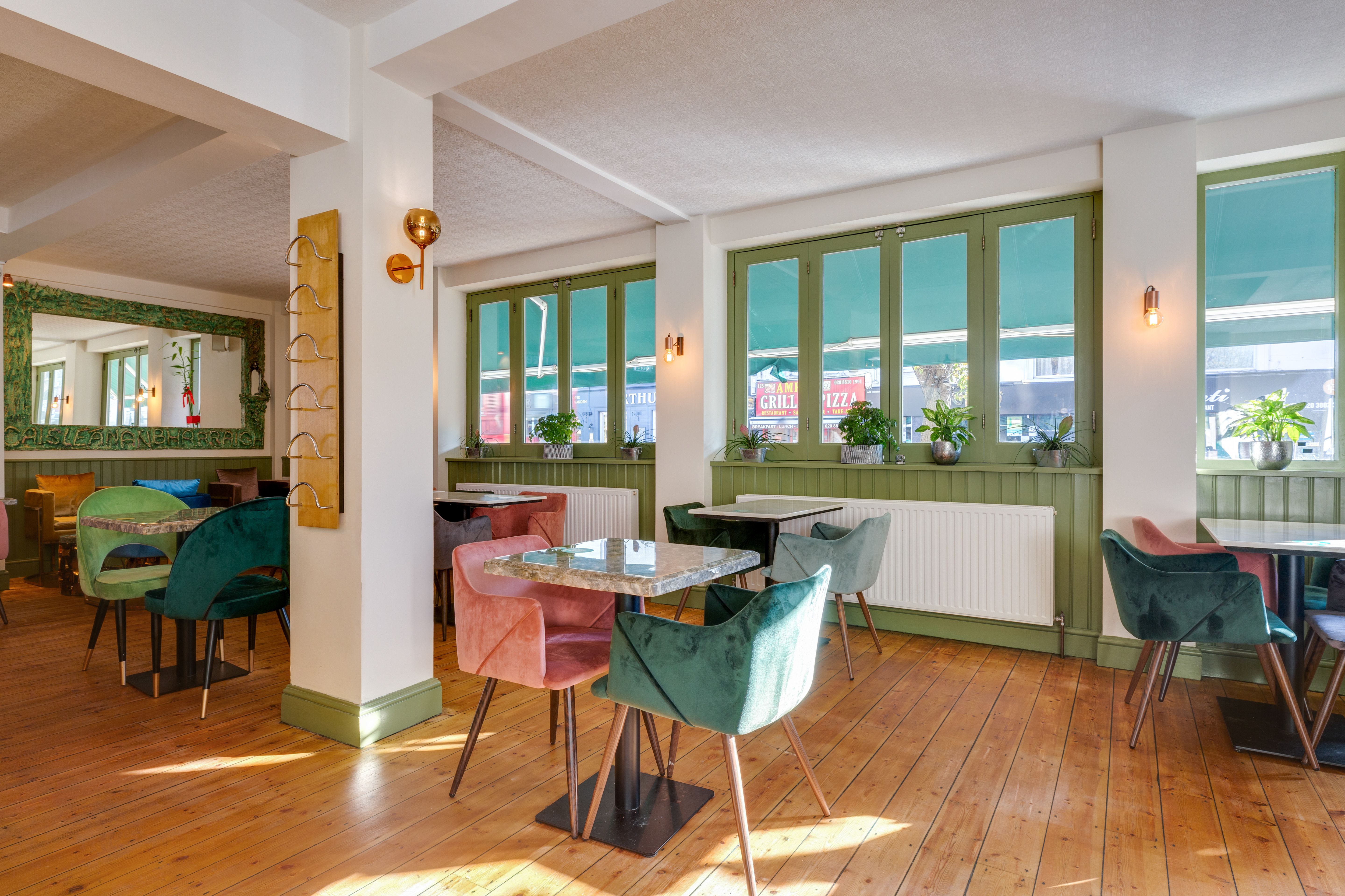 Trendy interior of cafe with creative lamps and wooden furniture · Free ...