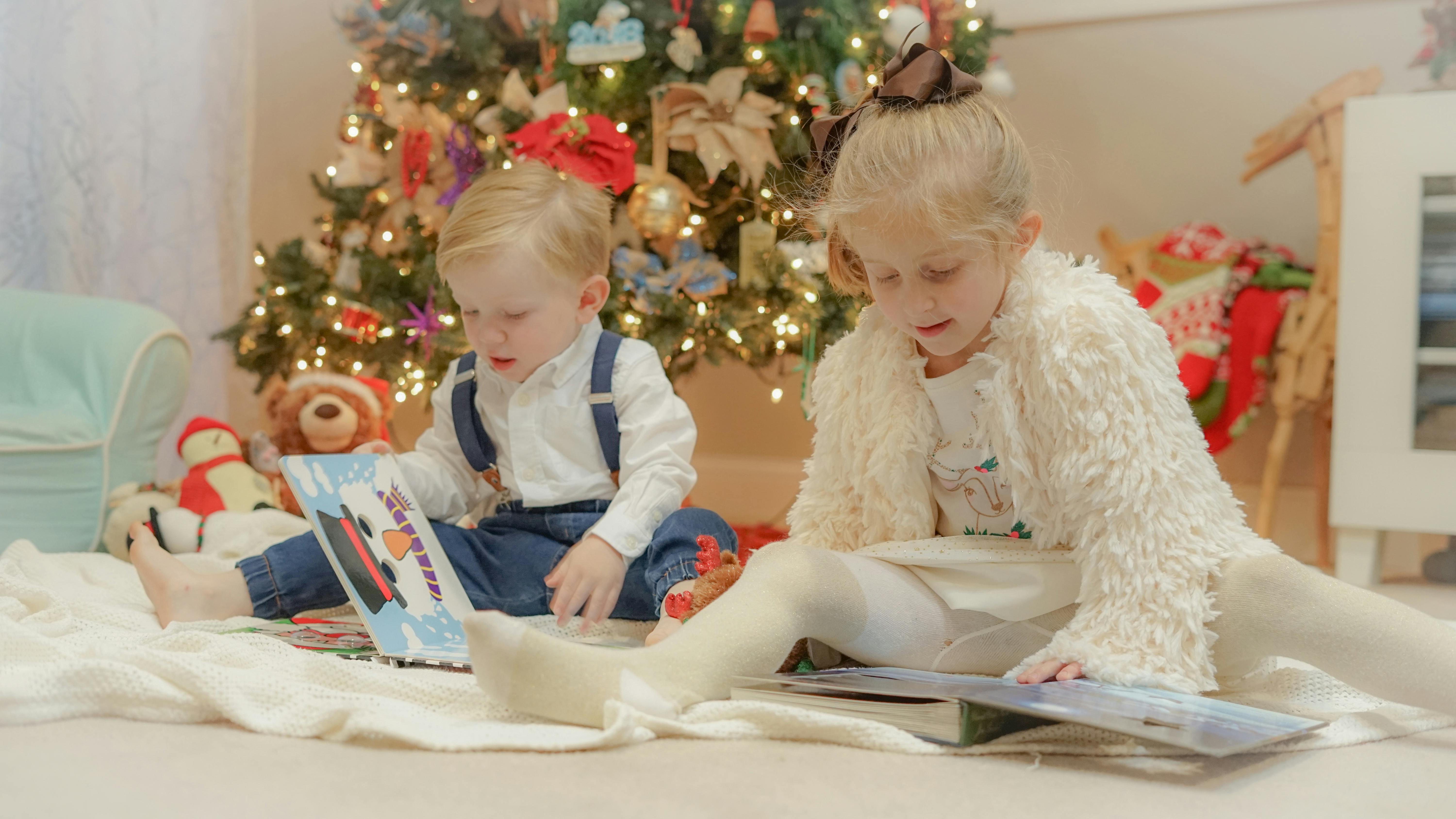 Photograph of Children Reading a Book · Free Stock Photo