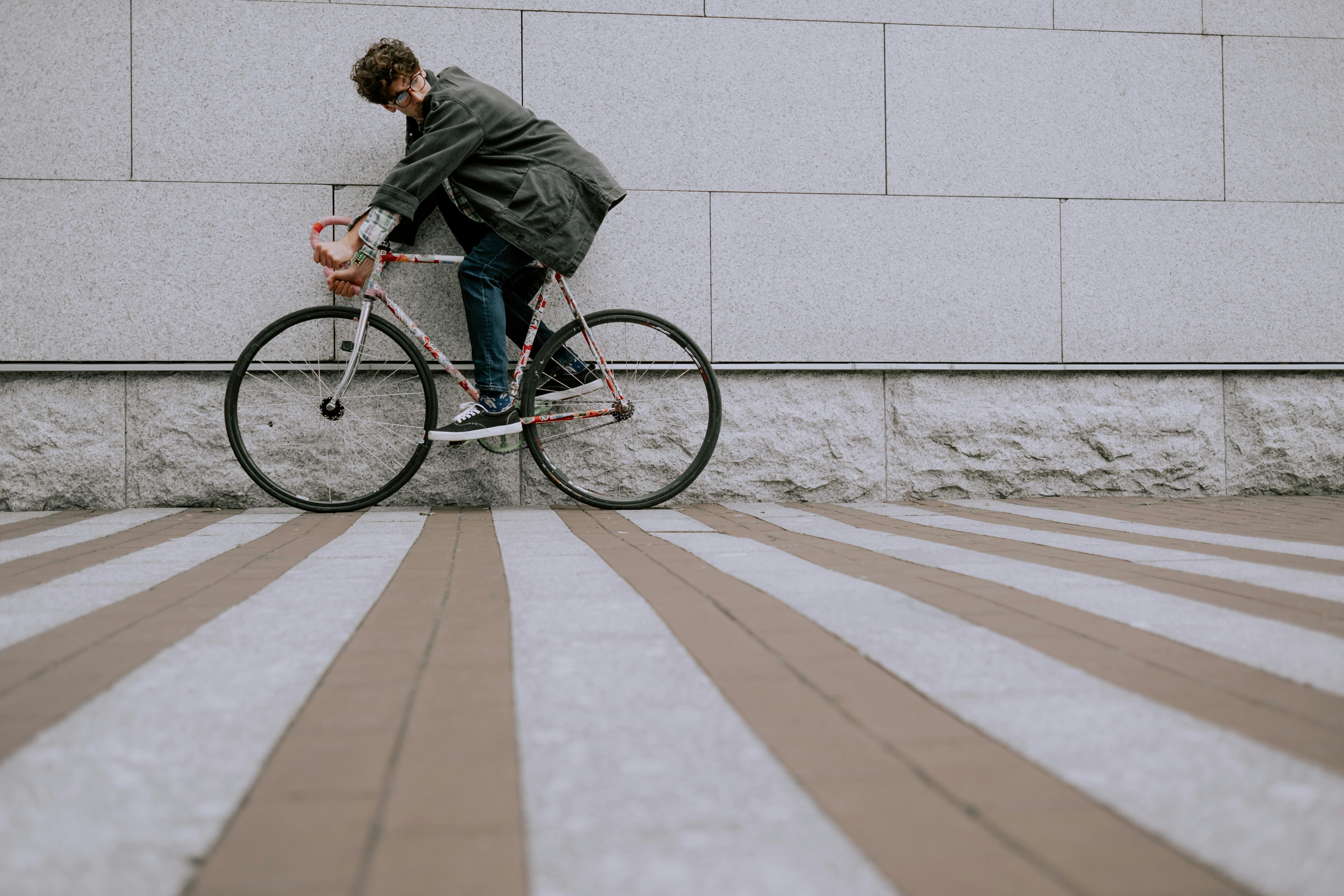 Man Riding a Bike in Motion · Free Stock Photo