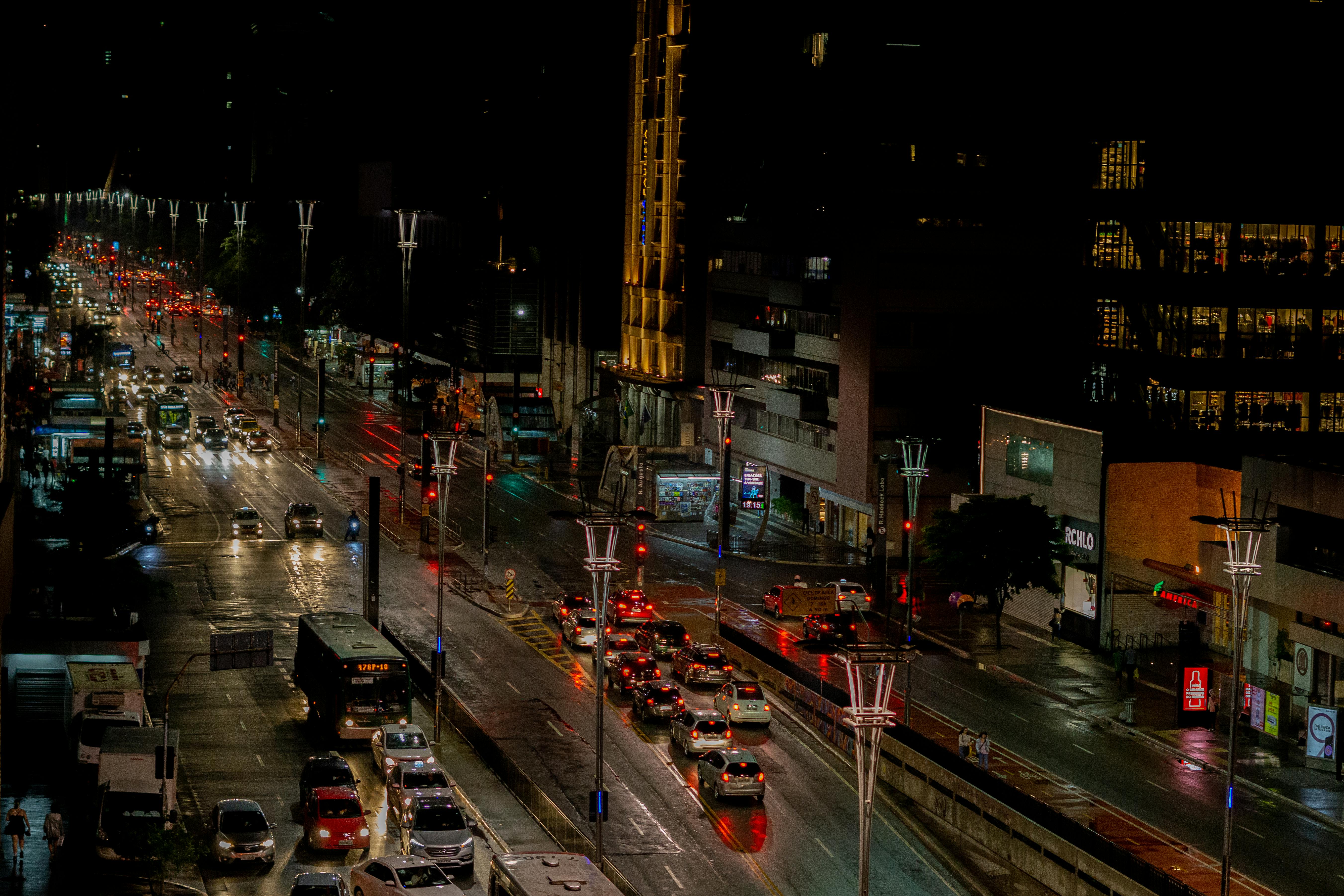 Cars riding on road at night time · Free Stock Photo