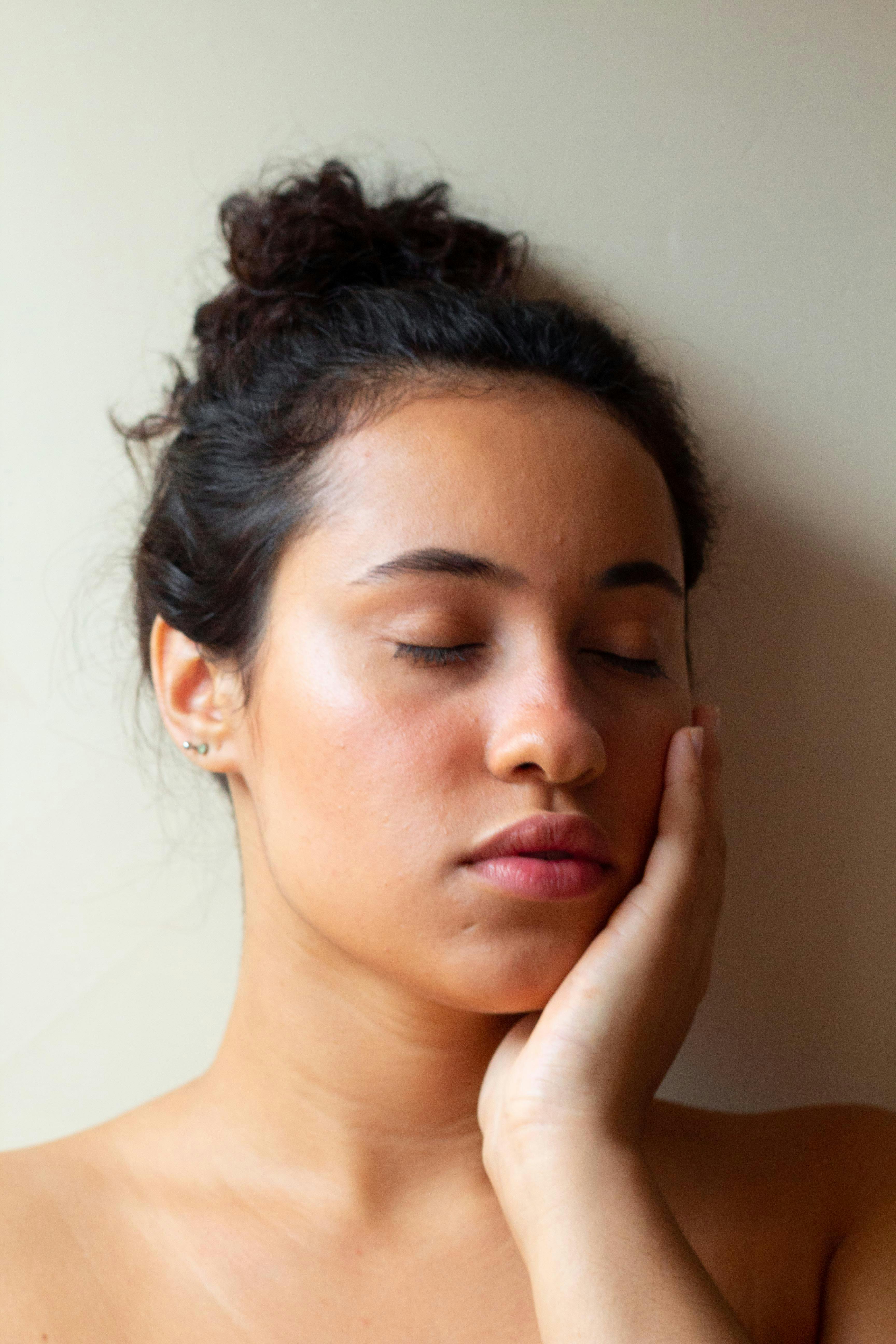 A Woman with Her Hand on Cheek · Free Stock Photo