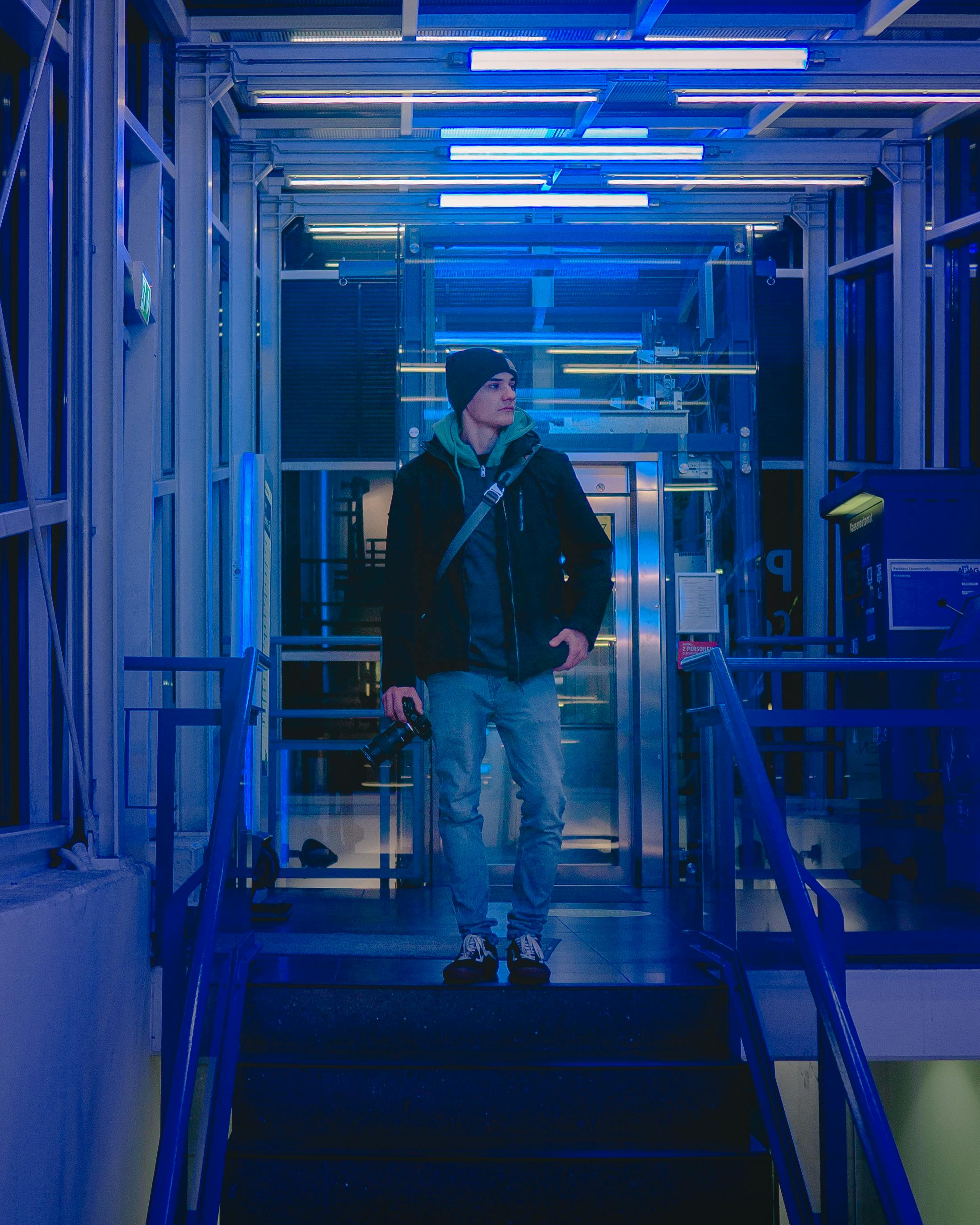 Blue Light Reflection on Man in Blue Jacket · Free Stock Photo