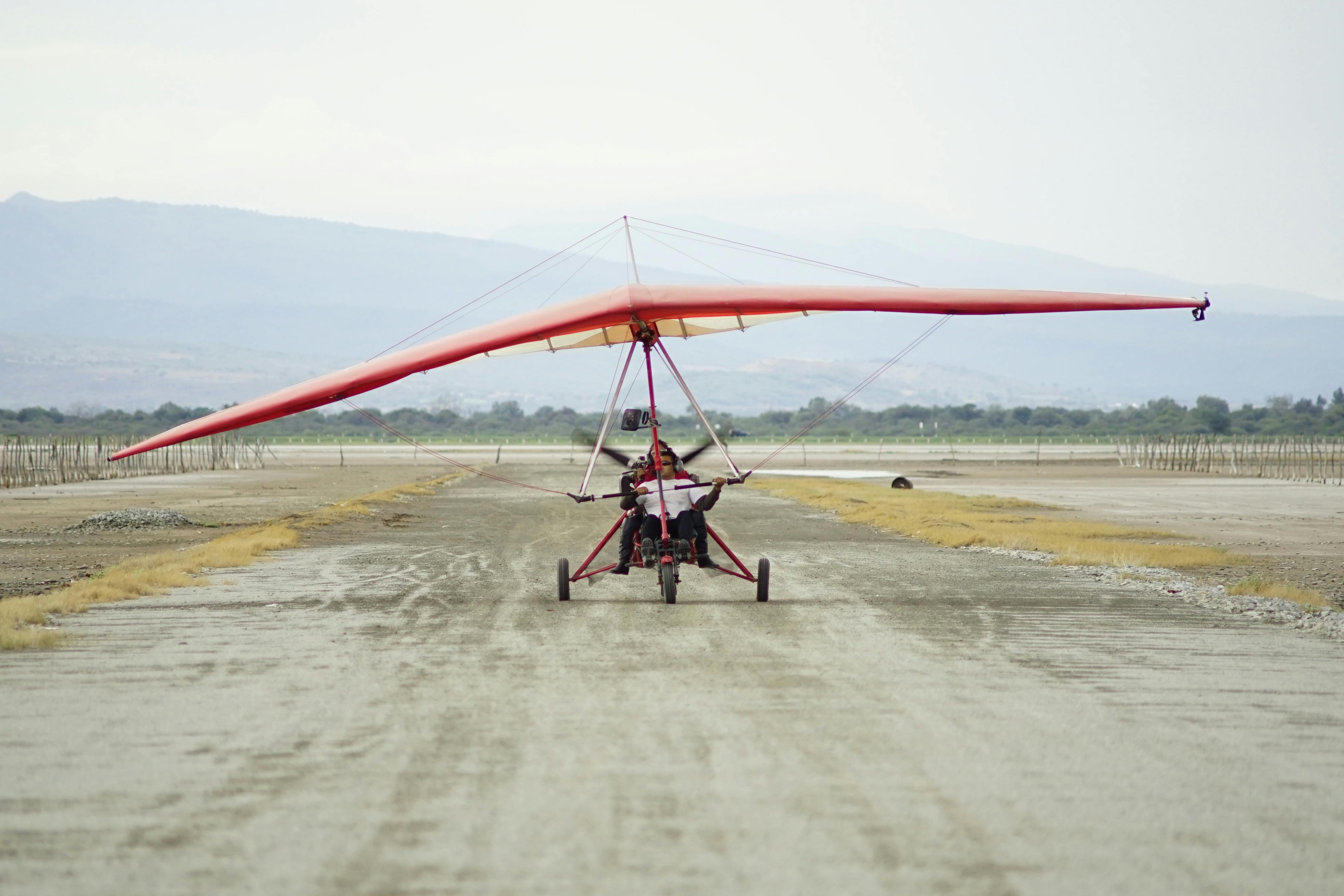 A Powered Hang Glider in the Runway · Free Stock Photo