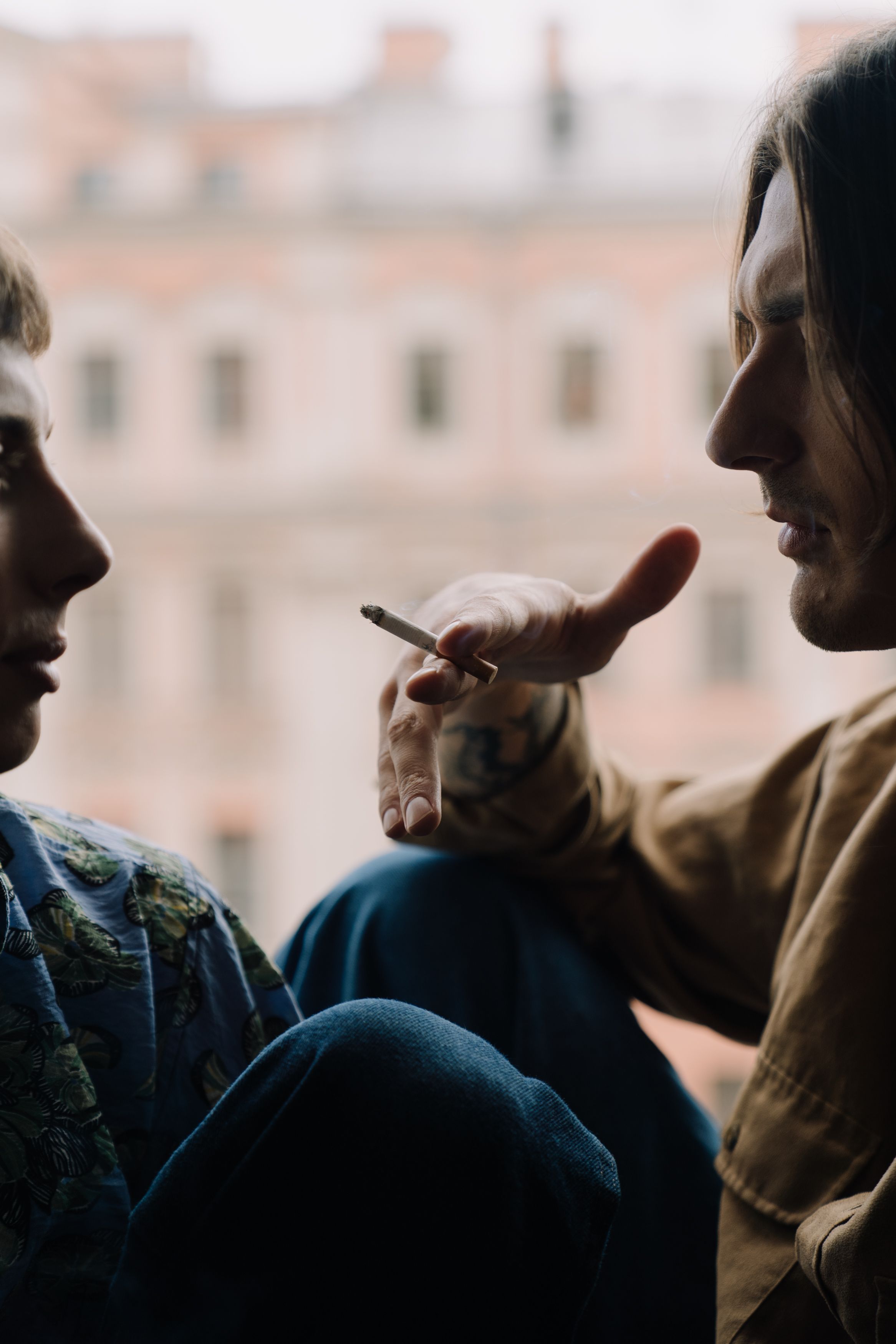 Man and Woman Smoking Cigarettes Together · Free Stock Photo