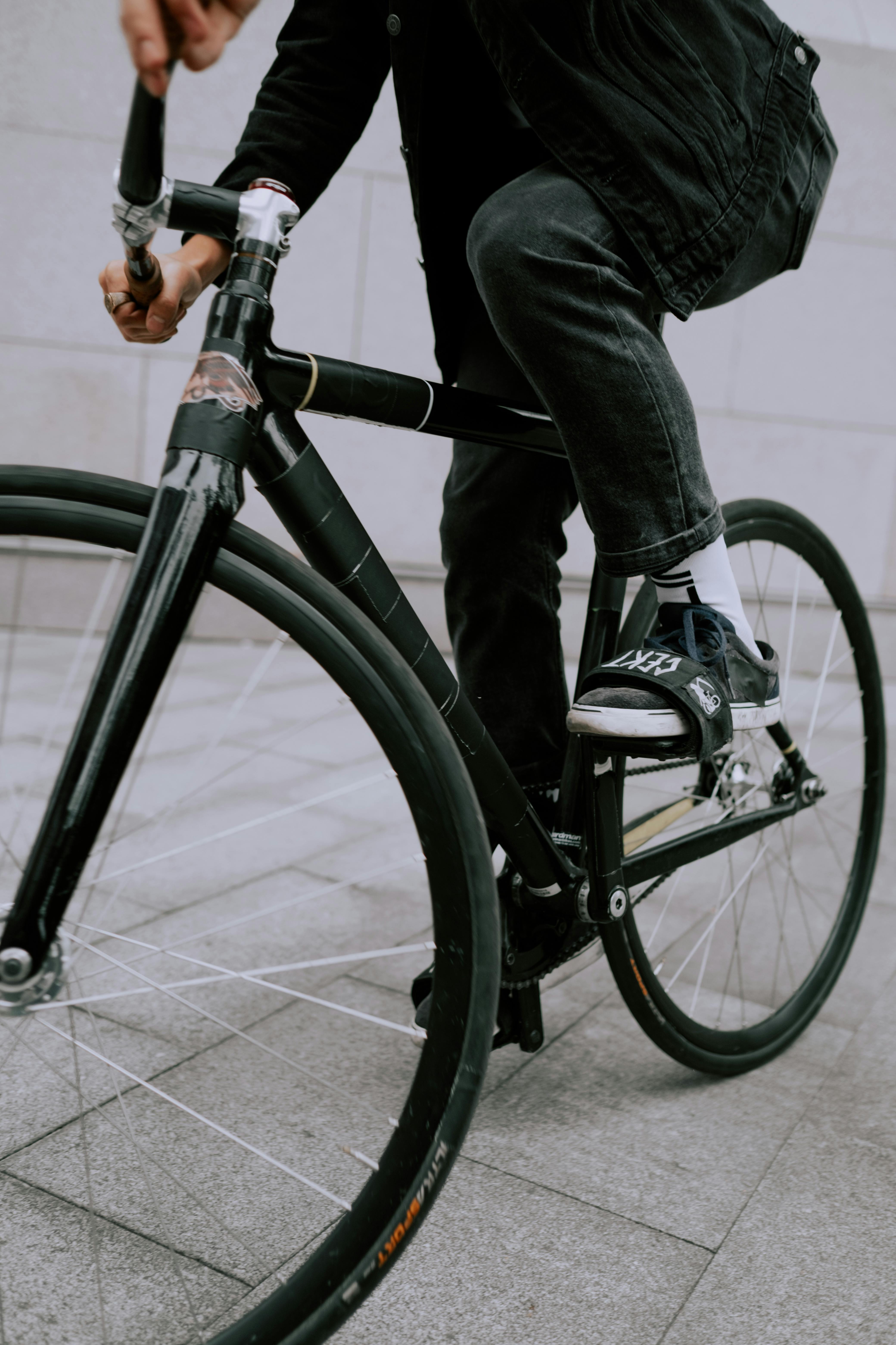 Person Riding a Black Fixie Bicycle · Free Stock Photo