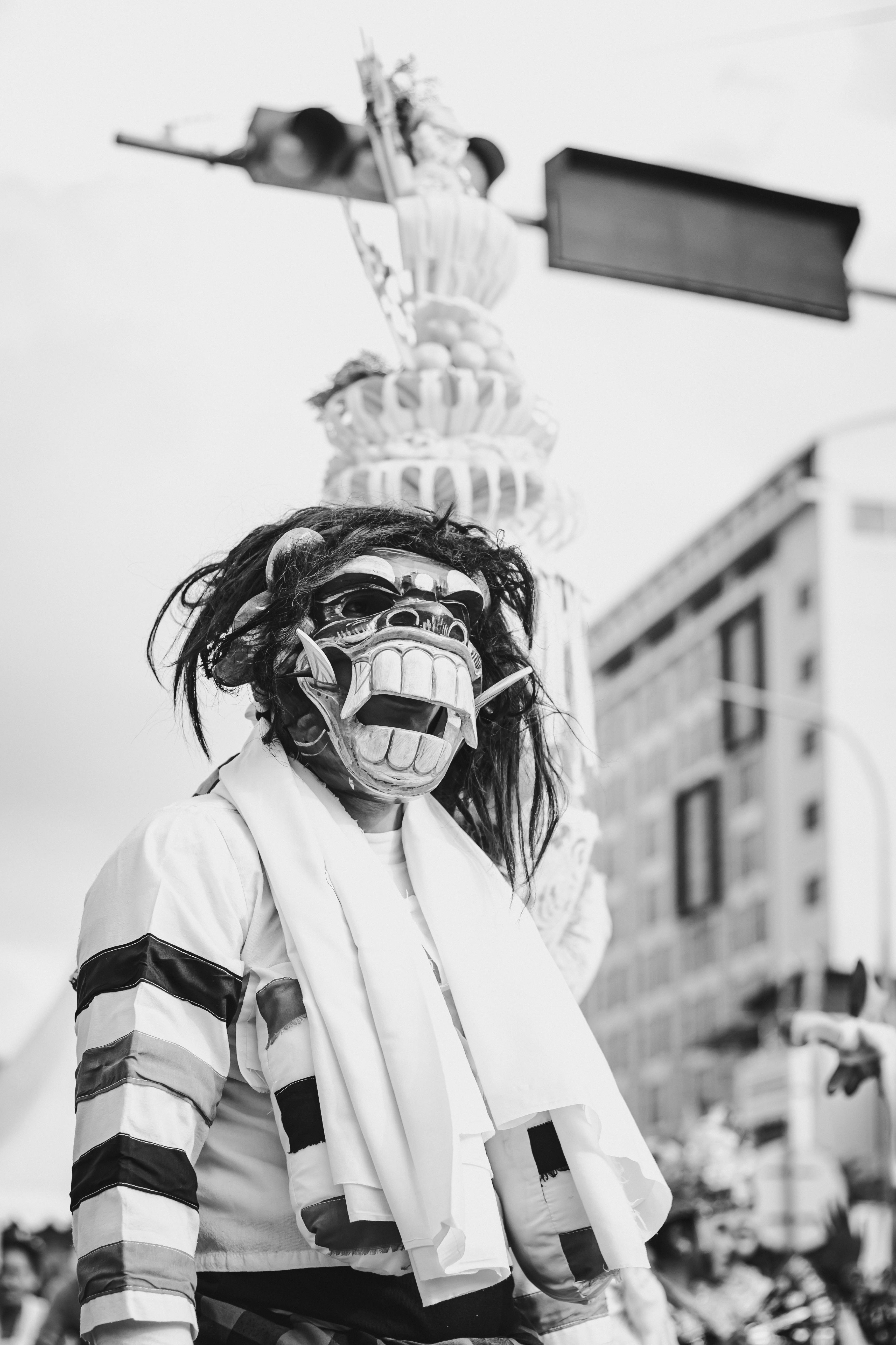 A Person Wearing a Mask in a City · Free Stock Photo