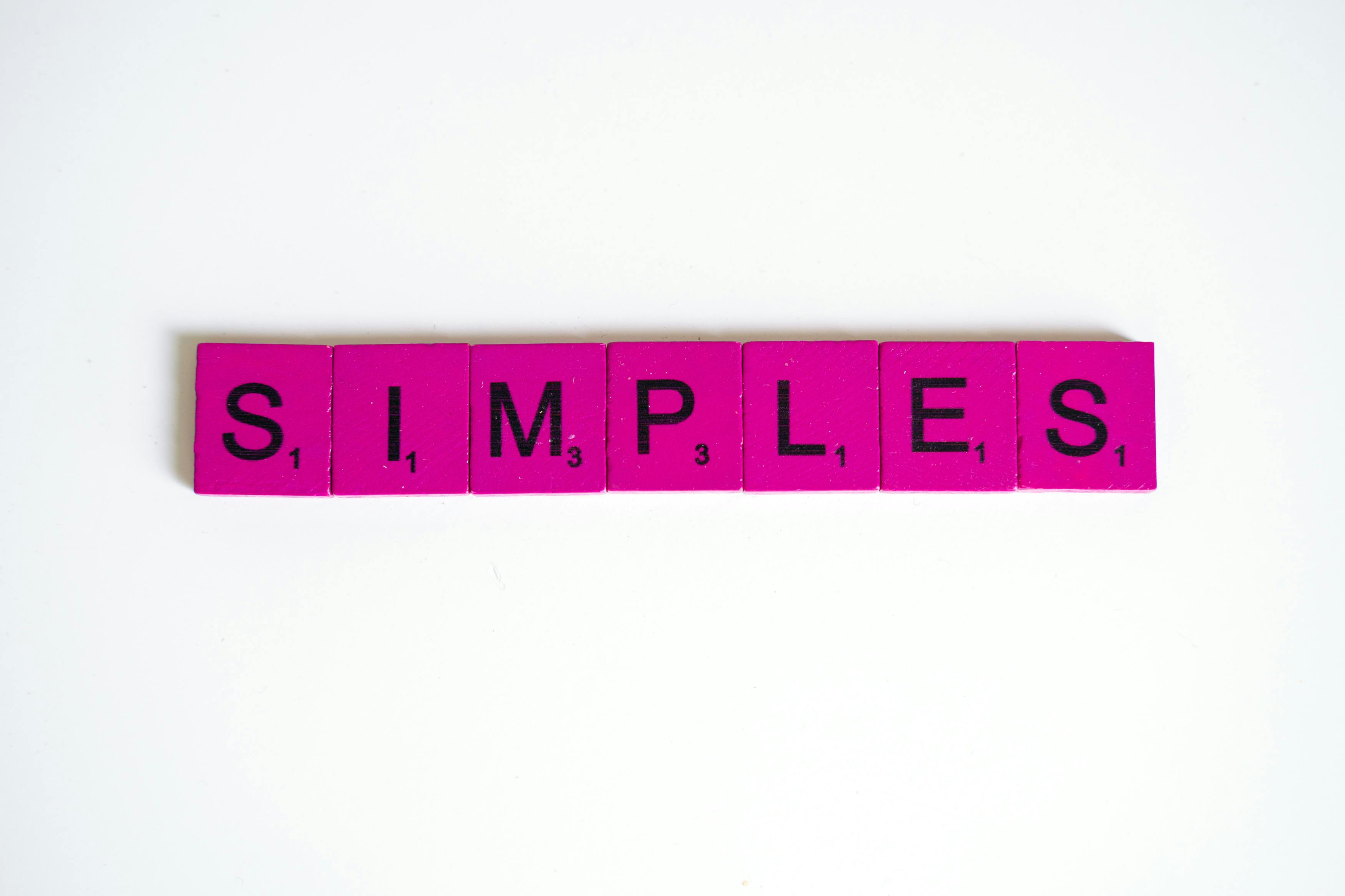 Pink and Black Scrabble Tiles on White Surface · Free Stock Photo