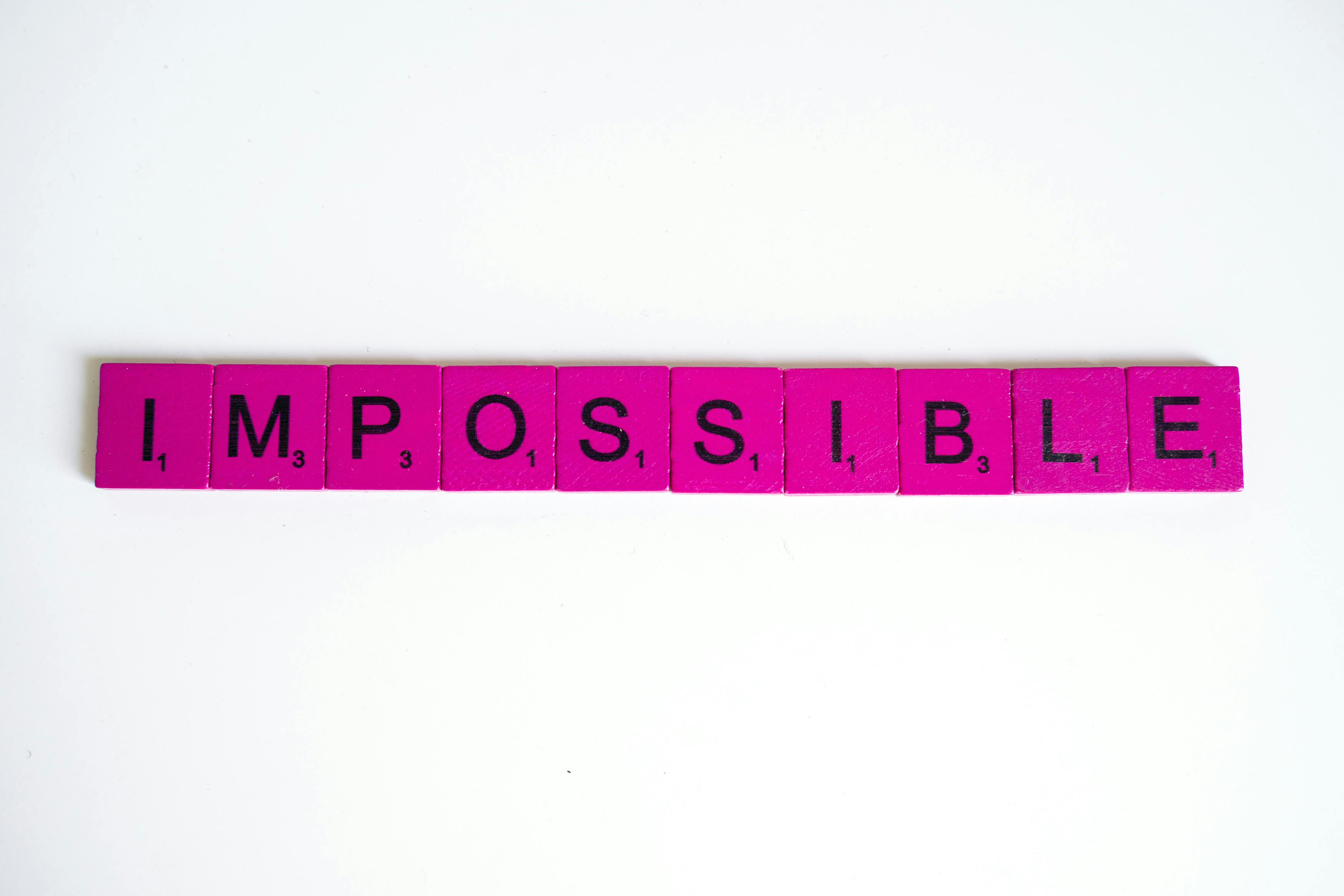 Scrabble Tiles on a White Surface · Free Stock Photo