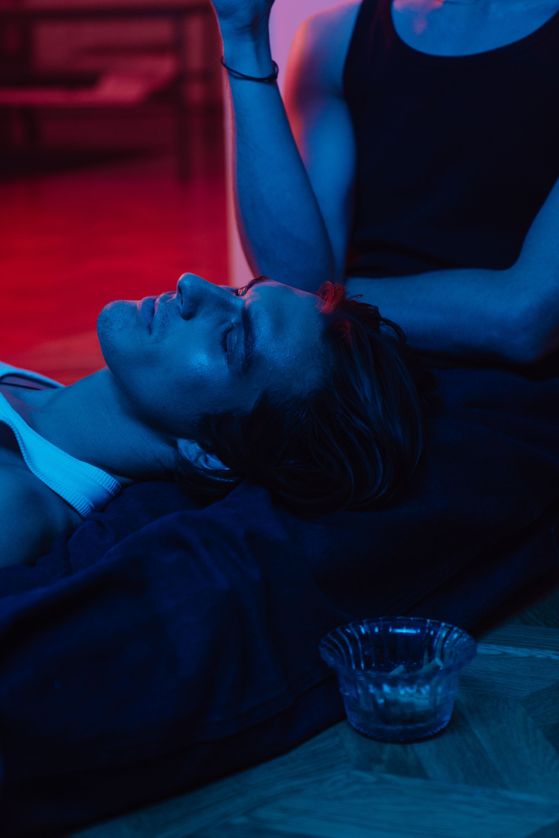 A Man Lying Down on a Person's Legs · Free Stock Photo