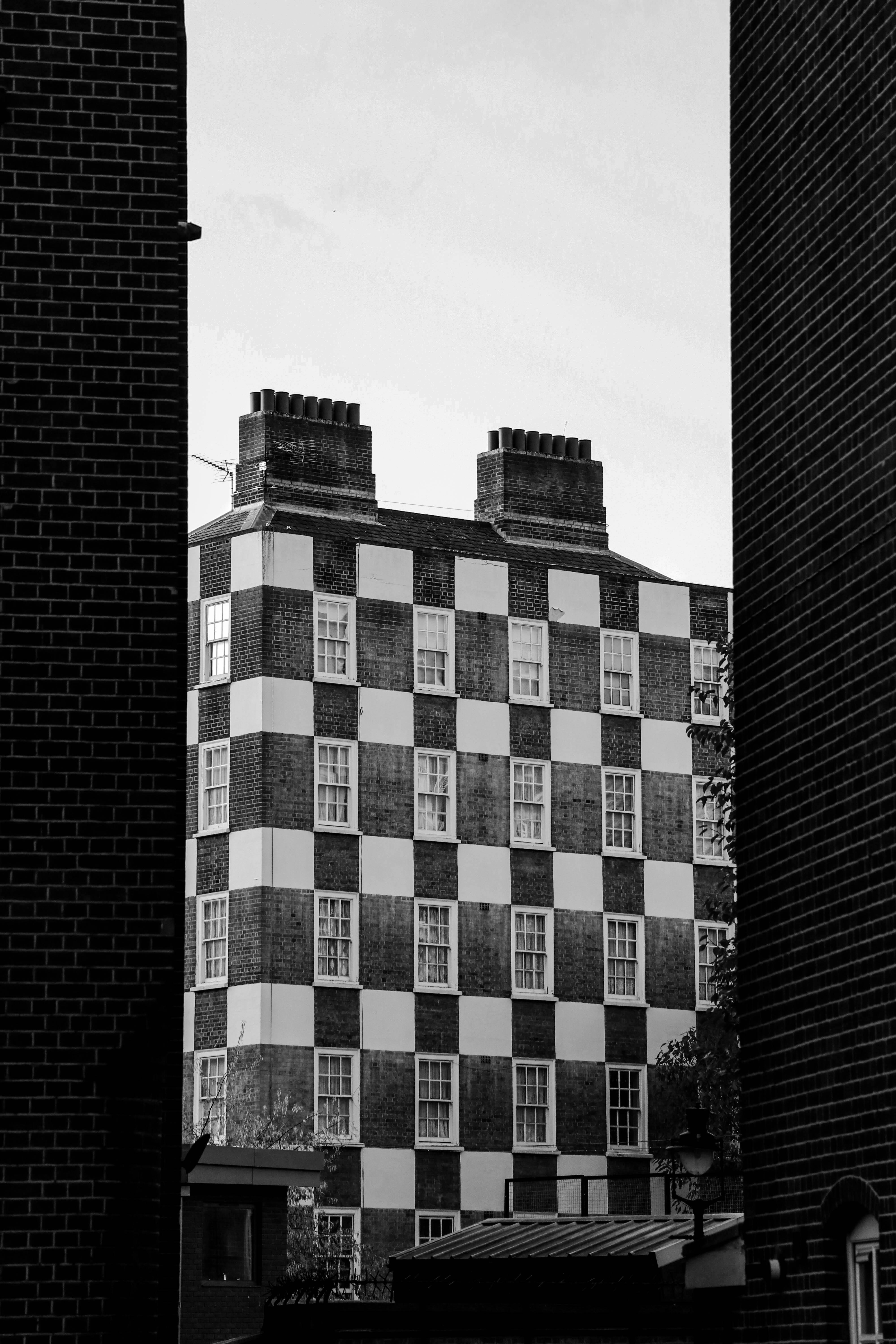 Grayscale Photo of Concrete Wall · Free Stock Photo