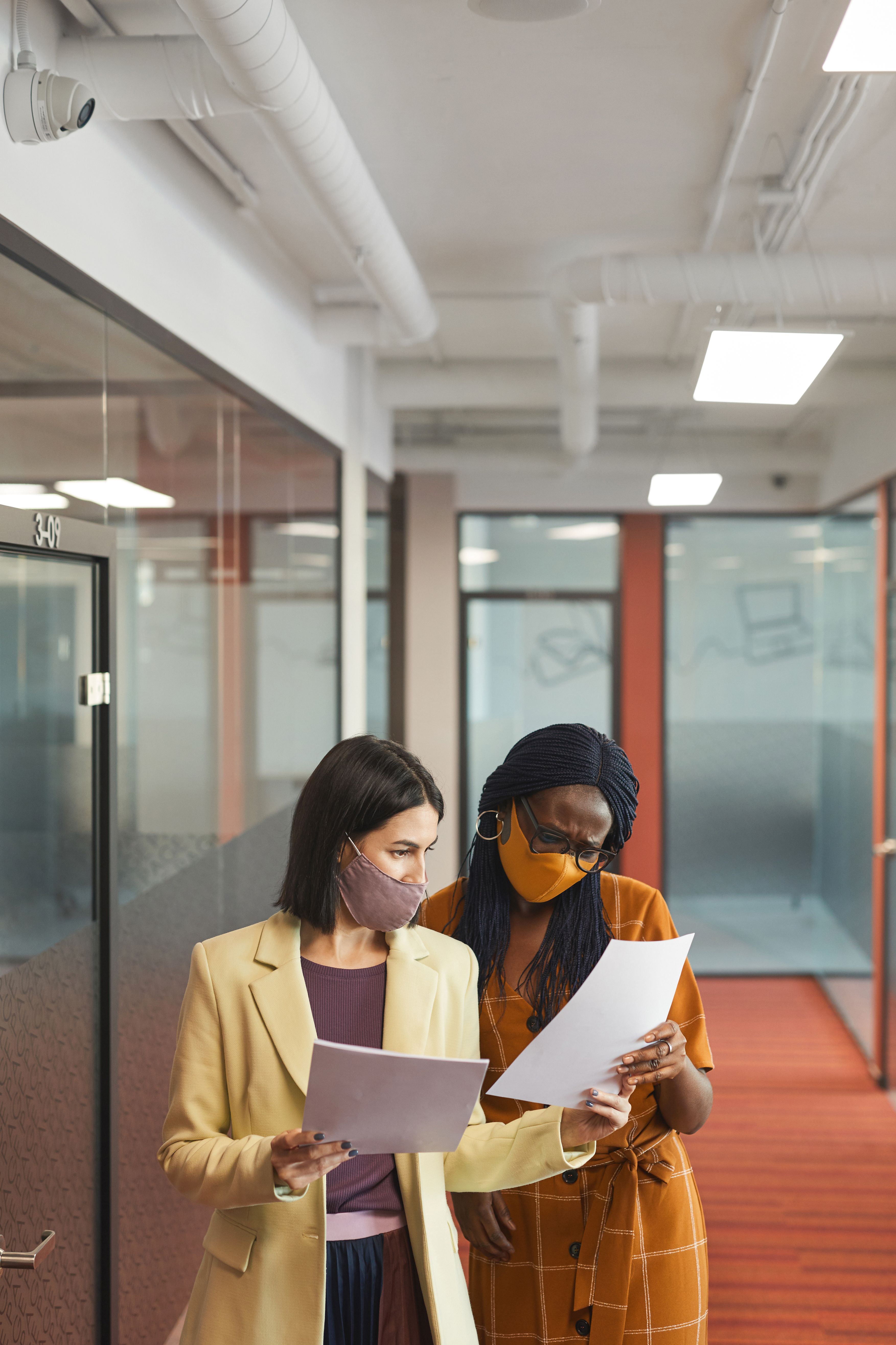 Two Women Holding Documents · Free Stock Photo