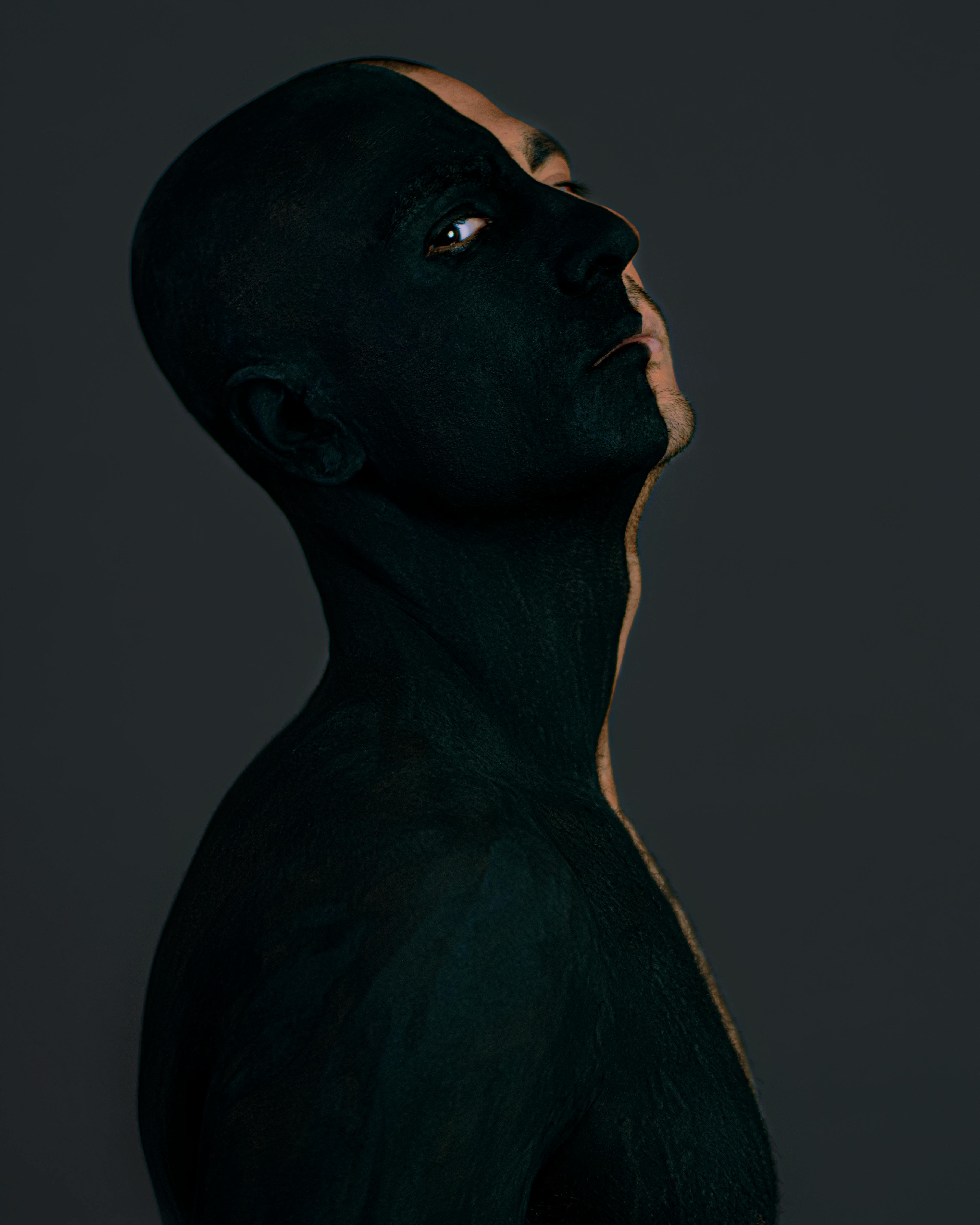 Person Painted Black on Face · Free Stock Photo