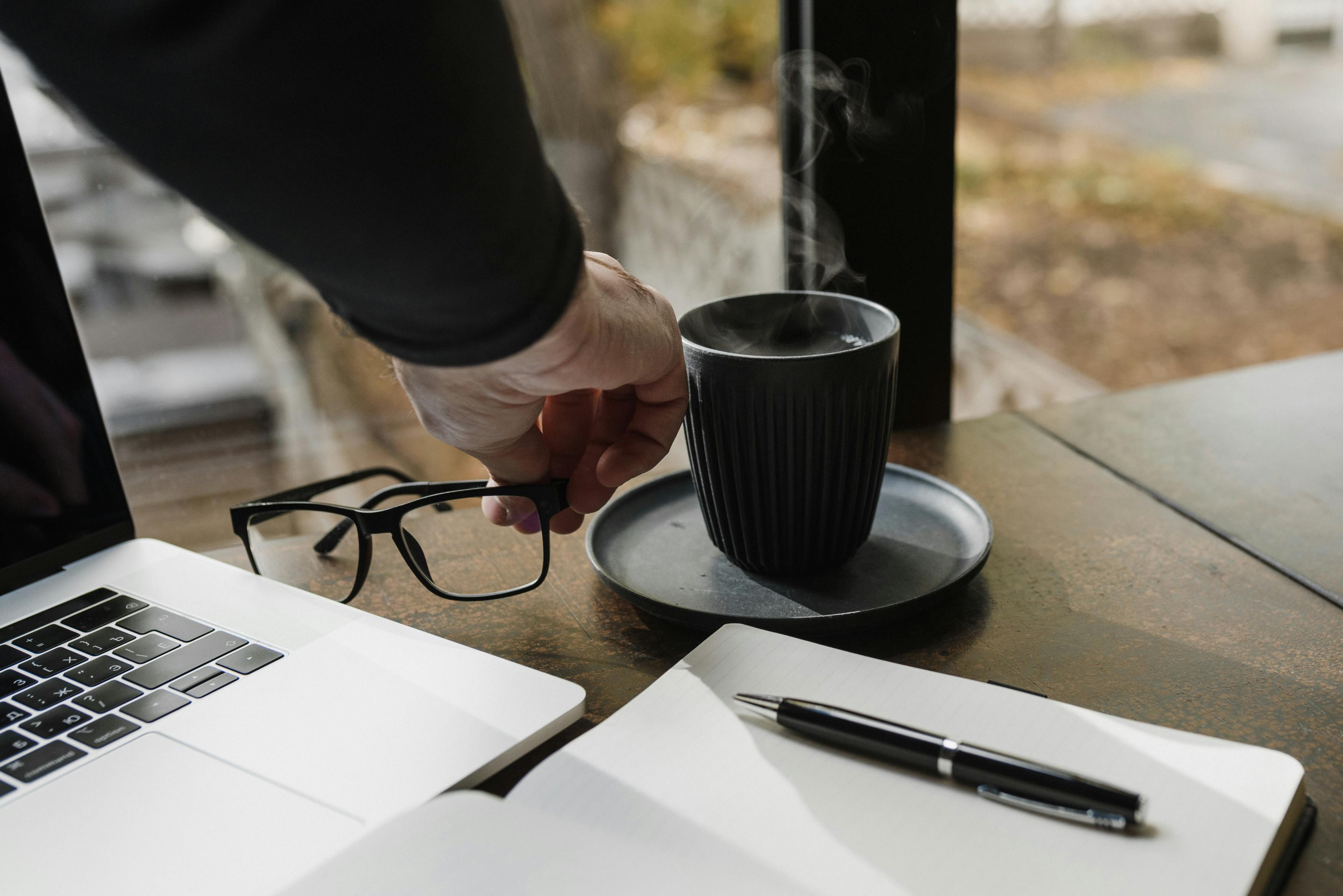 Person Holding Black Framed Eyeglasses · Free Stock Photo