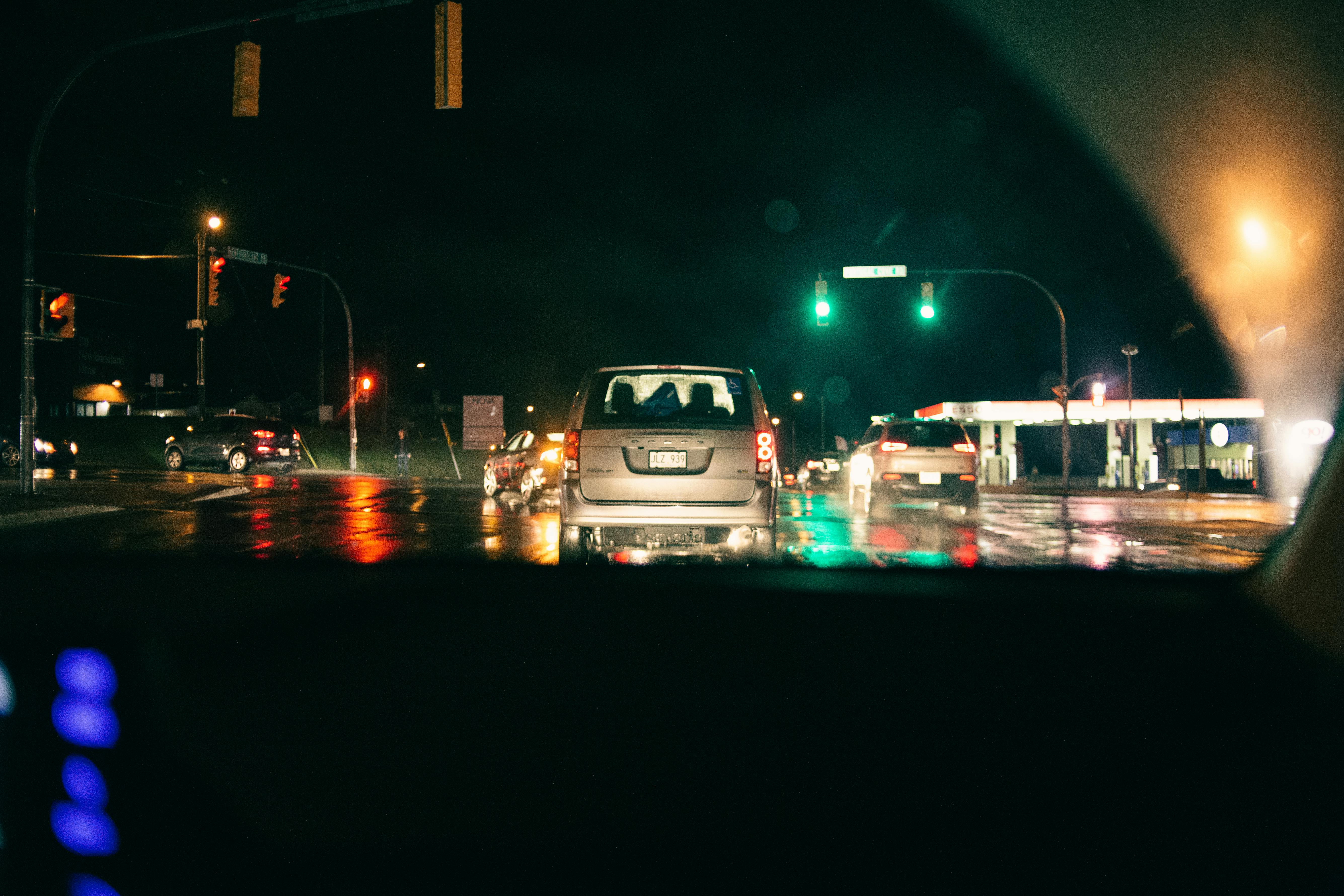 Modern car riding on city street at night · Free Stock Photo