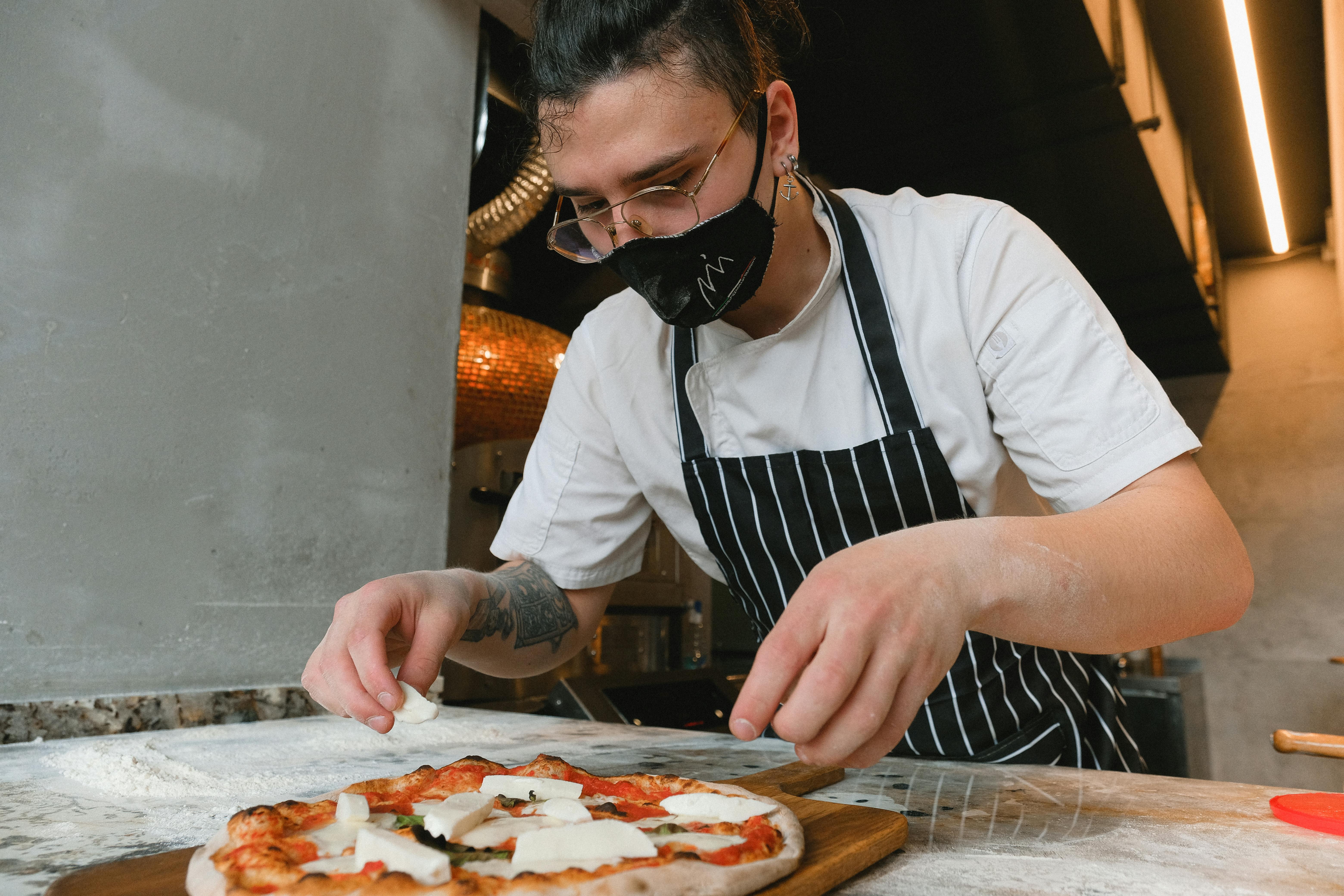 A Chef Making Pizza · Free Stock Photo