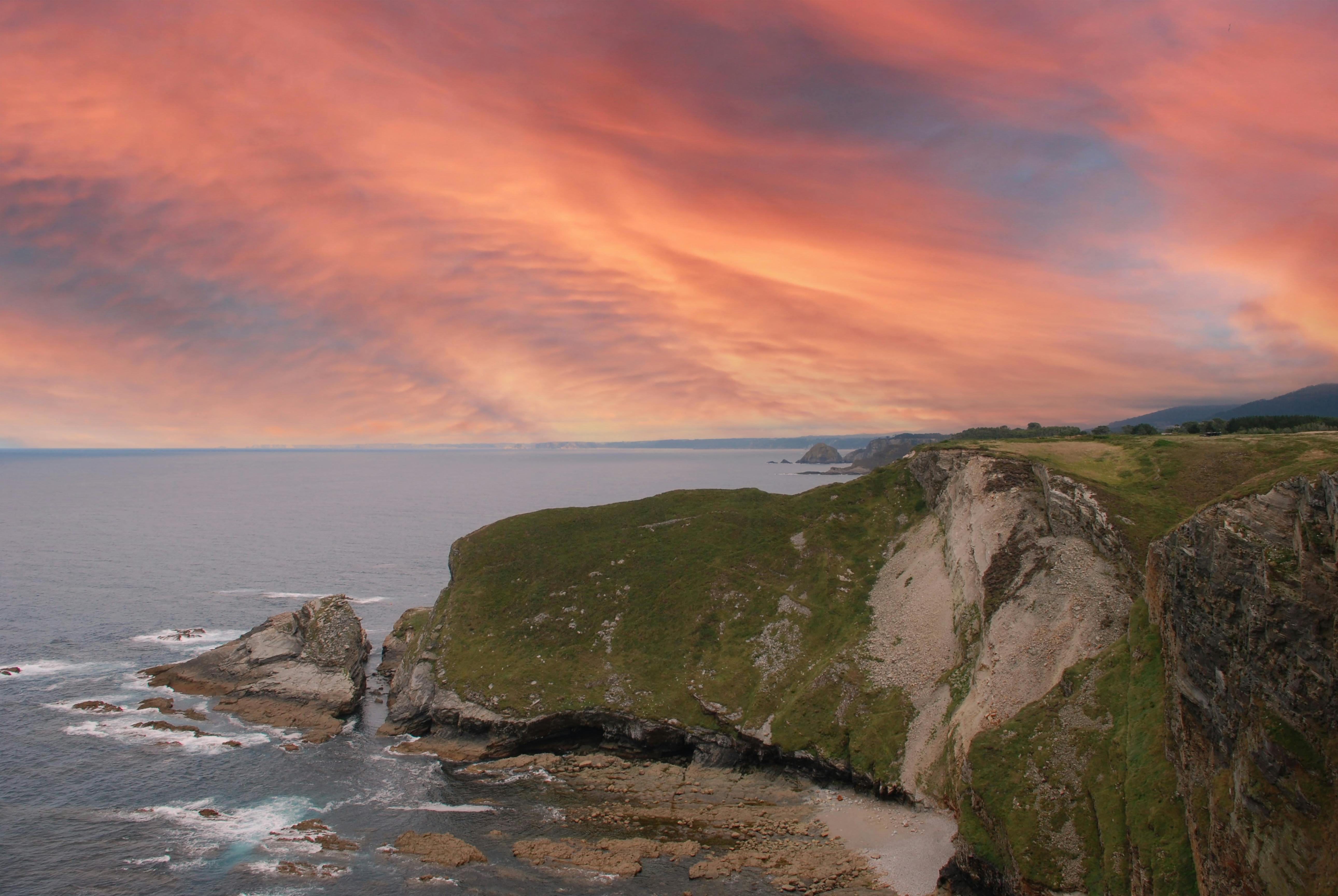 Green Mountain Cliff on the Coastline · Free Stock Photo