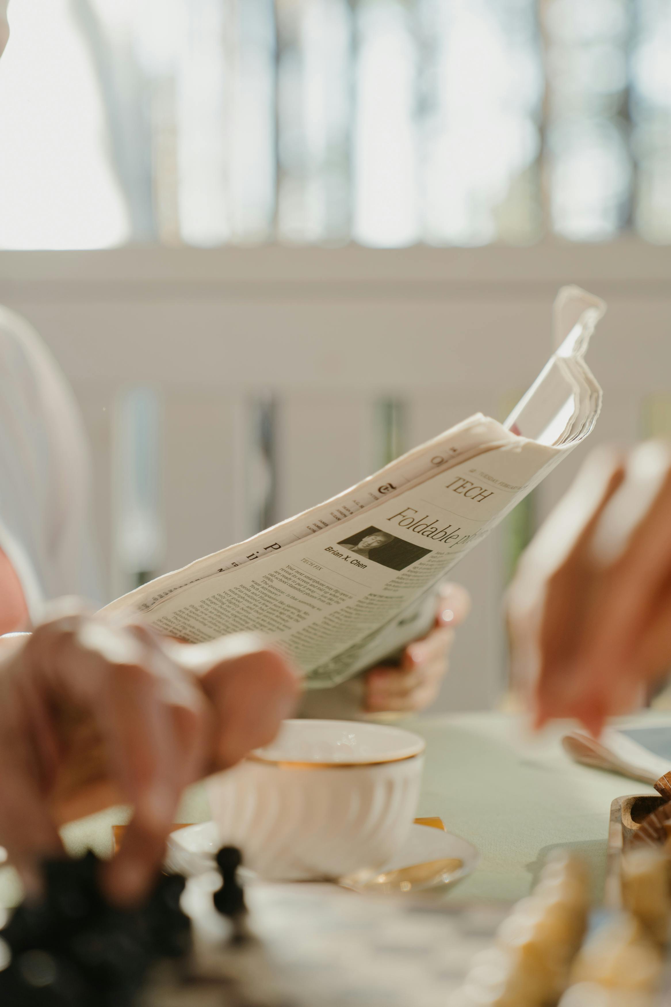 Person Holding White Newspaper · Free Stock Photo
