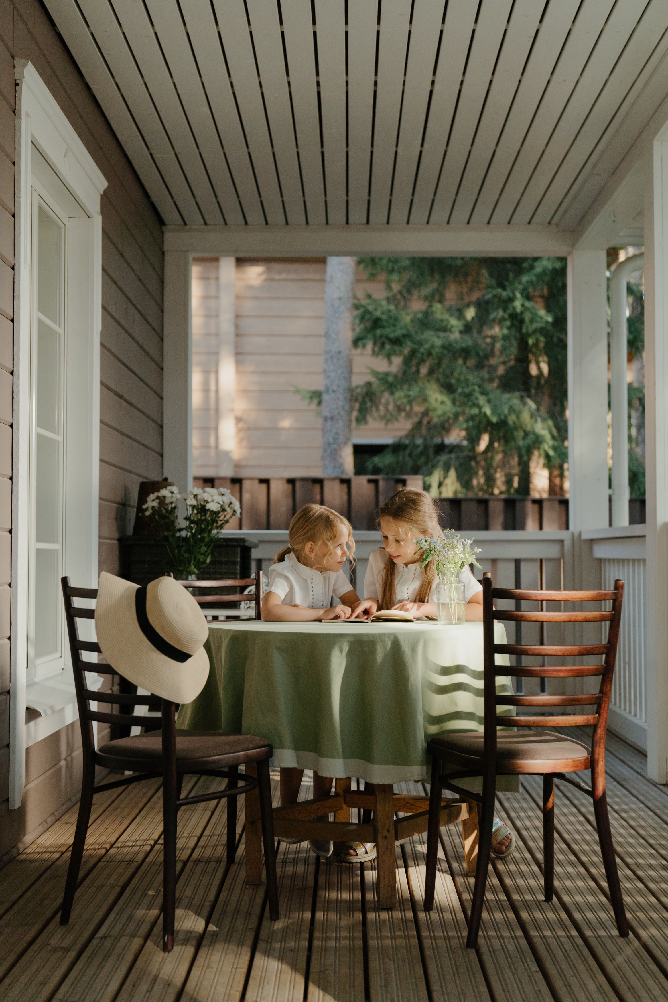 Children Reading a Book on a Table · Free Stock Photo
