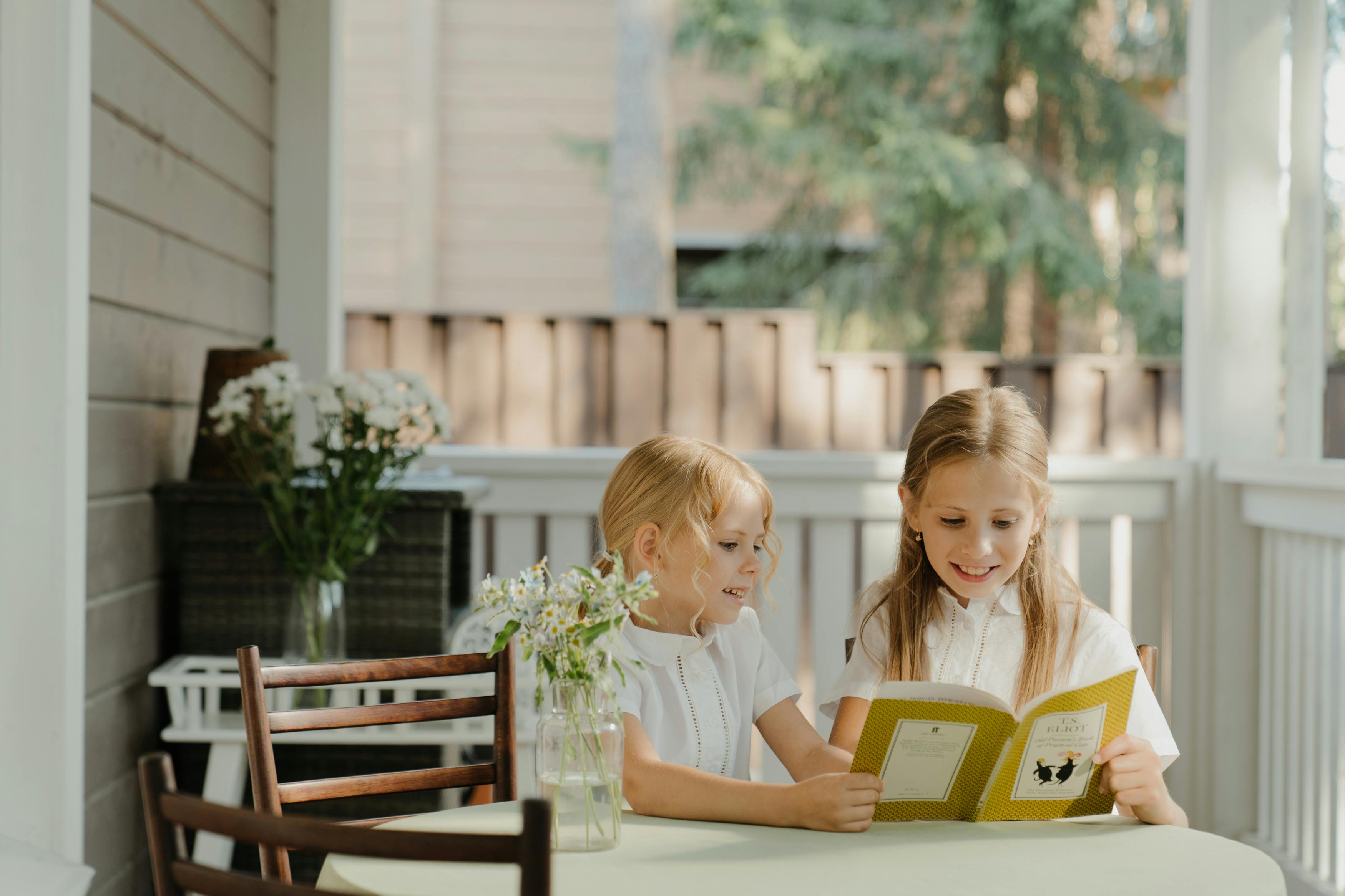 Siblings Reading a Book · Free Stock Photo