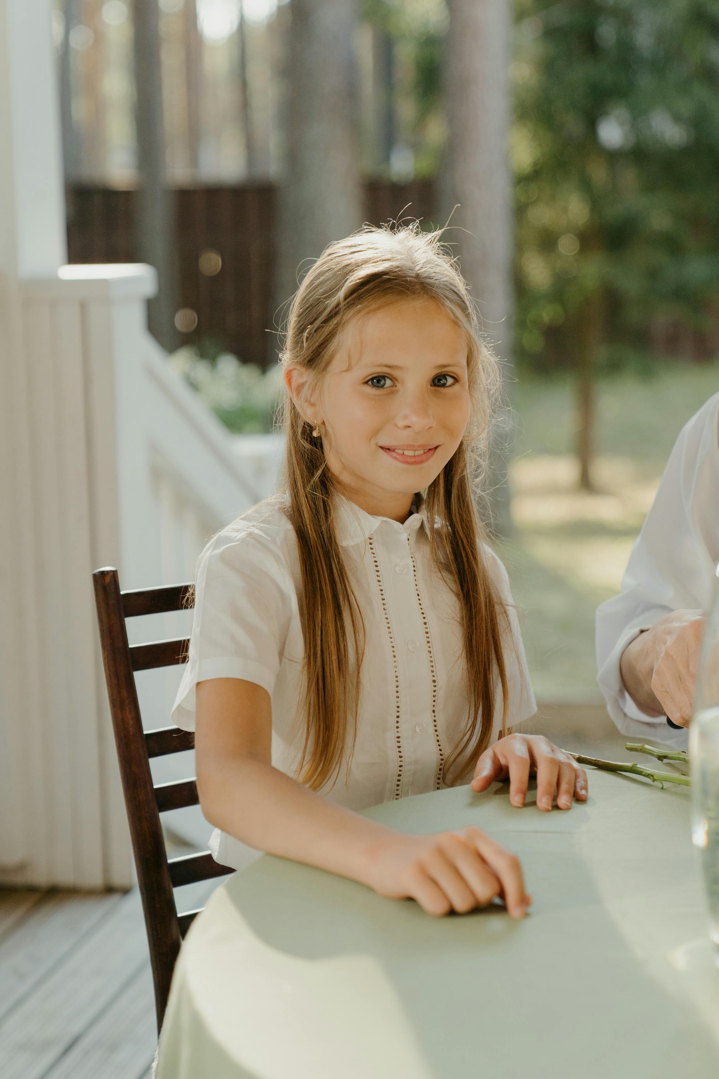Girl Sitting on Table · Free Stock Photo