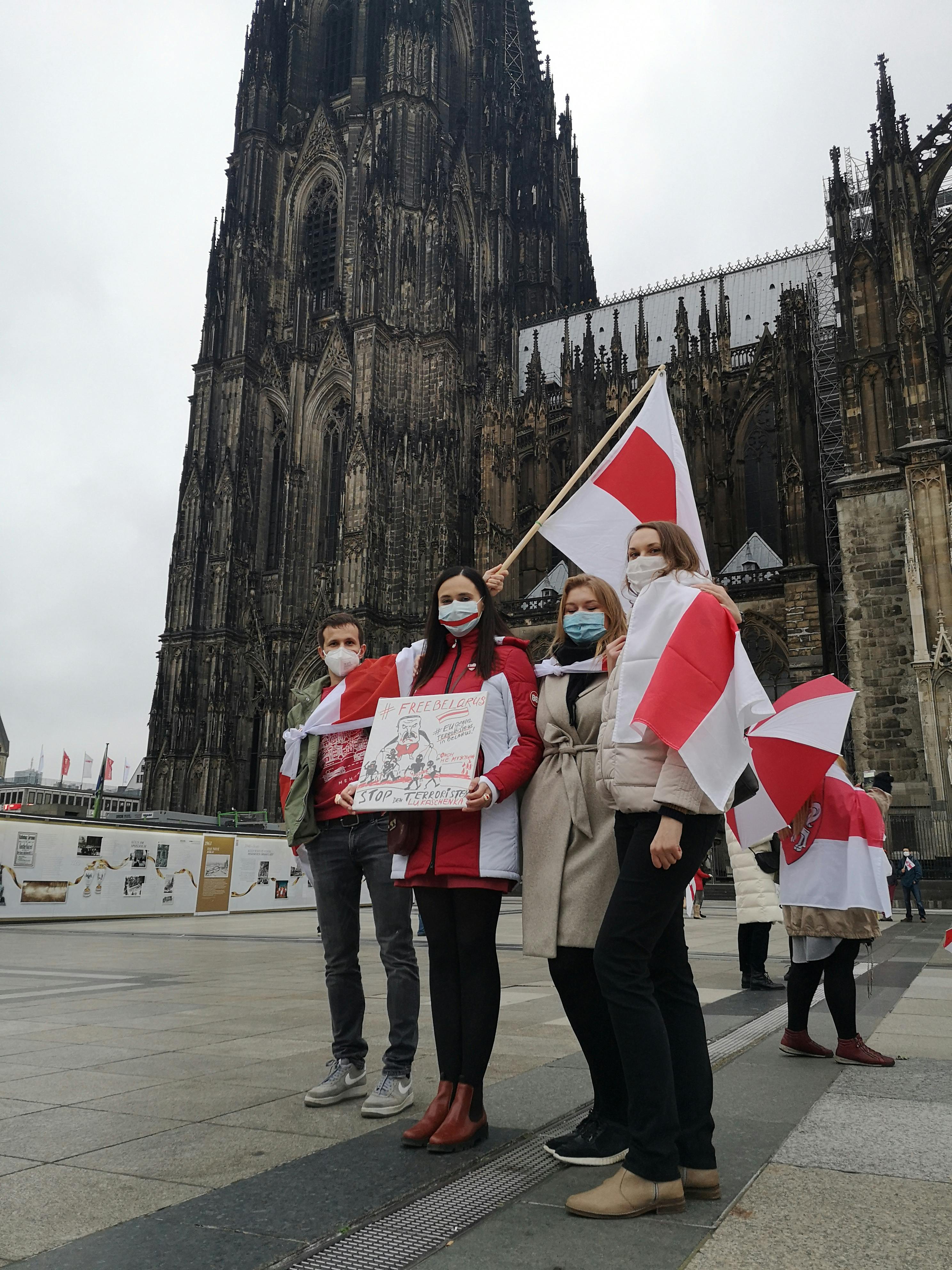 People Holding Flags Standing Near Brown Concrete Building · Free Stock ...