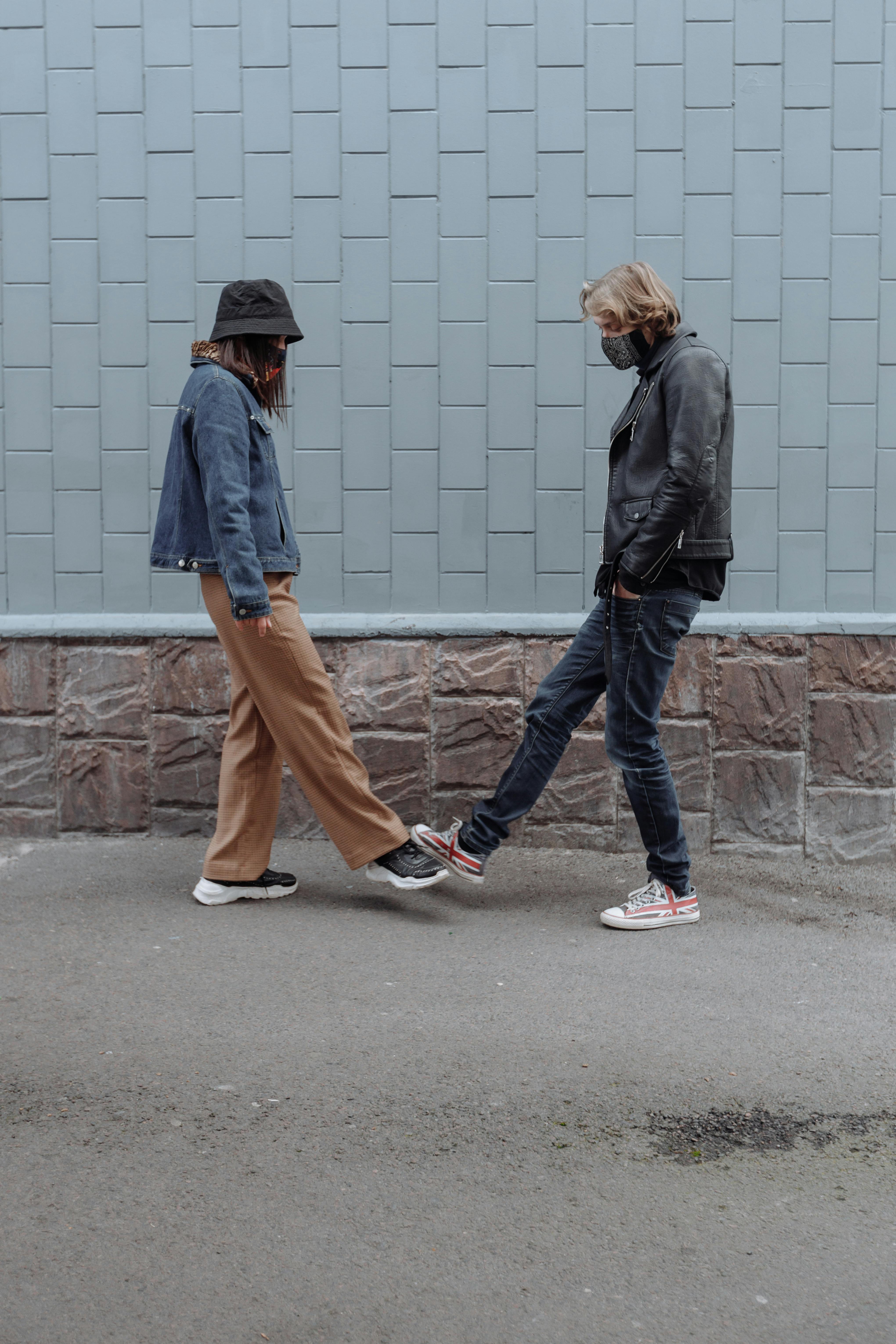 Man and Woman Touching Their Feet · Free Stock Photo
